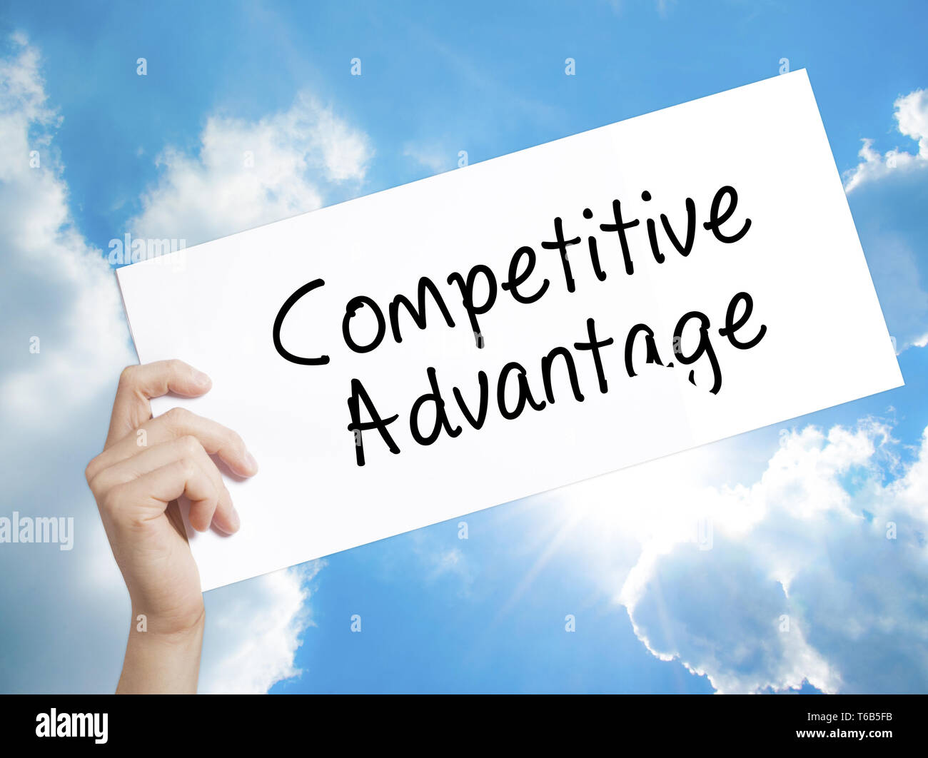 Competitive Advantage Sign on white paper. Man Hand Holding Paper with ...