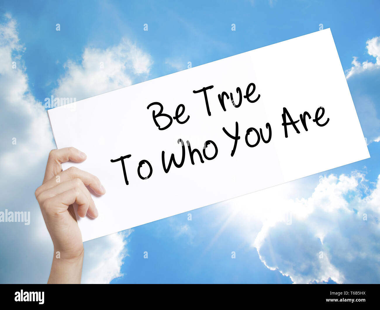 Be True To Who You Are Sign on white paper. Man Hand Holding Paper with ...