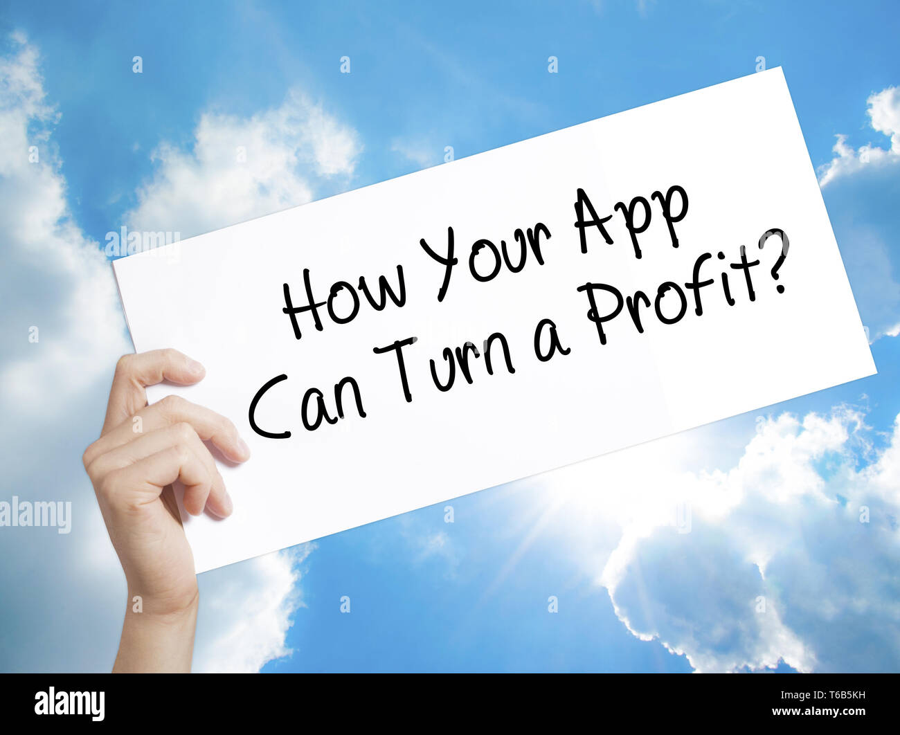 How Your App Can Turn a Profit? Sign on white paper. Man Hand Holding ...