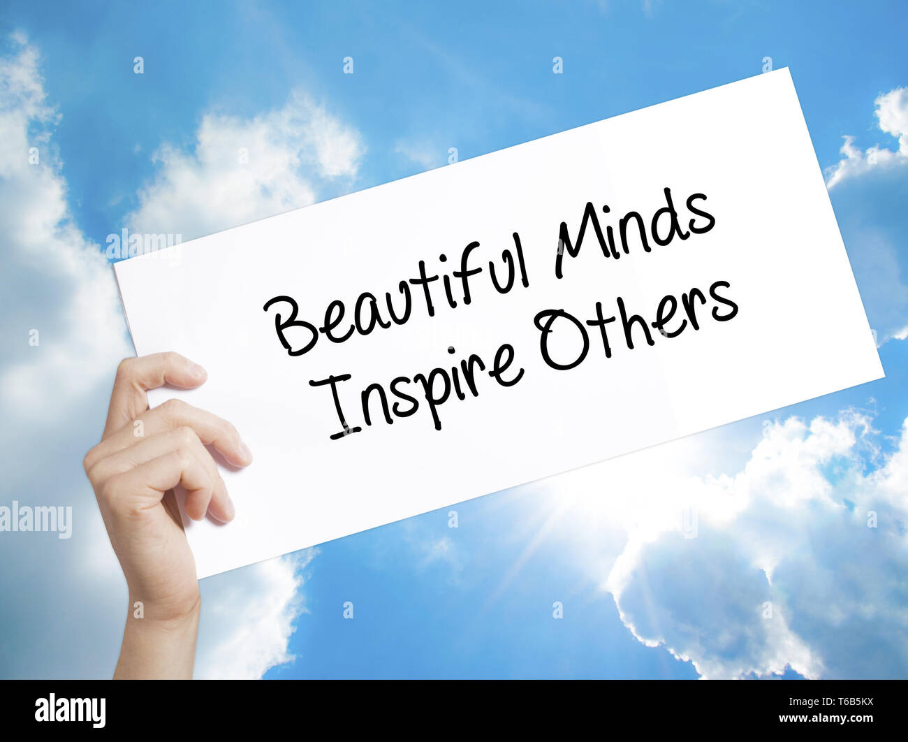 Beautiful Minds Inspire Others Sign on white paper. Man Hand Holding ...
