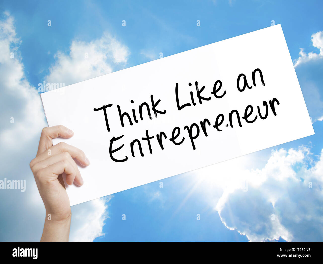 Think Like an Entrepreneur Sign on white paper. Man Hand Holding Paper ...