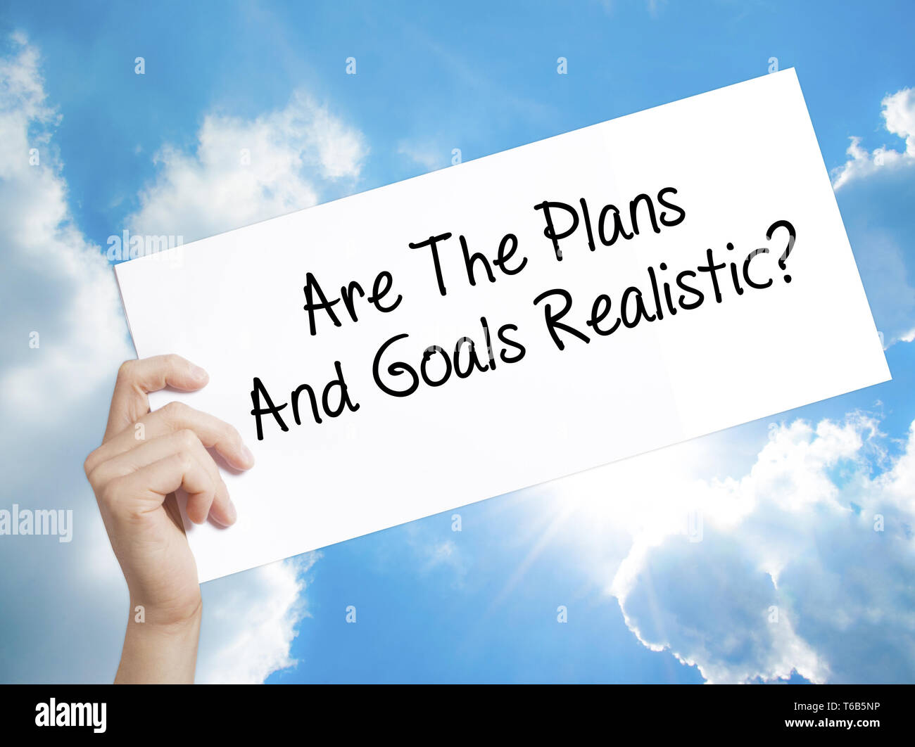 Are The Plans And Goals Realistic? Sign on white paper. Man Hand ...