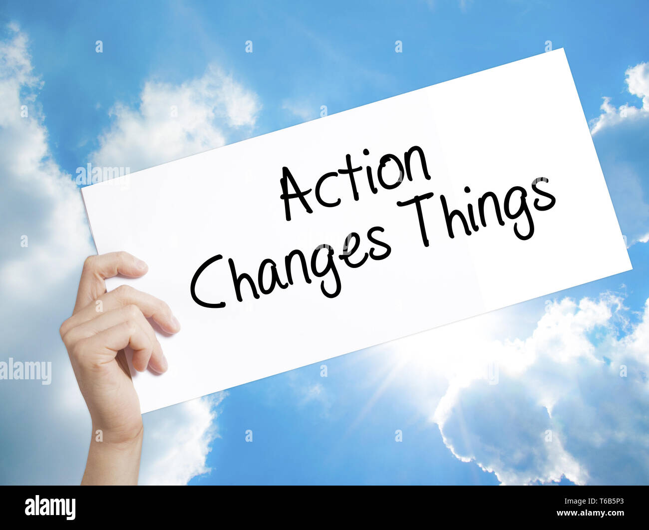 Action Changes Things Sign on white paper. Man Hand Holding Paper with ...