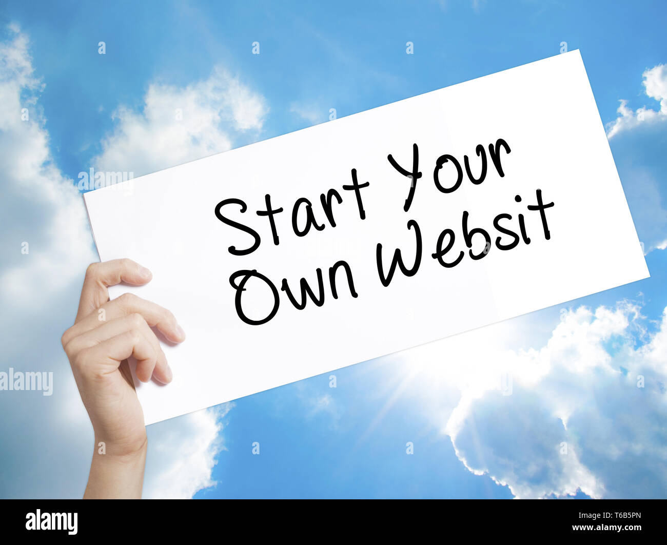 Start Your Own Website Sign on white paper. Man Hand Holding Paper with ...
