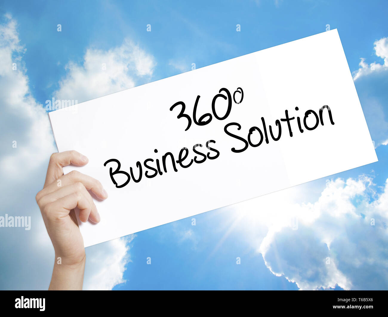 360 Business Solution Sign on white paper. Man Hand Holding Paper with ...