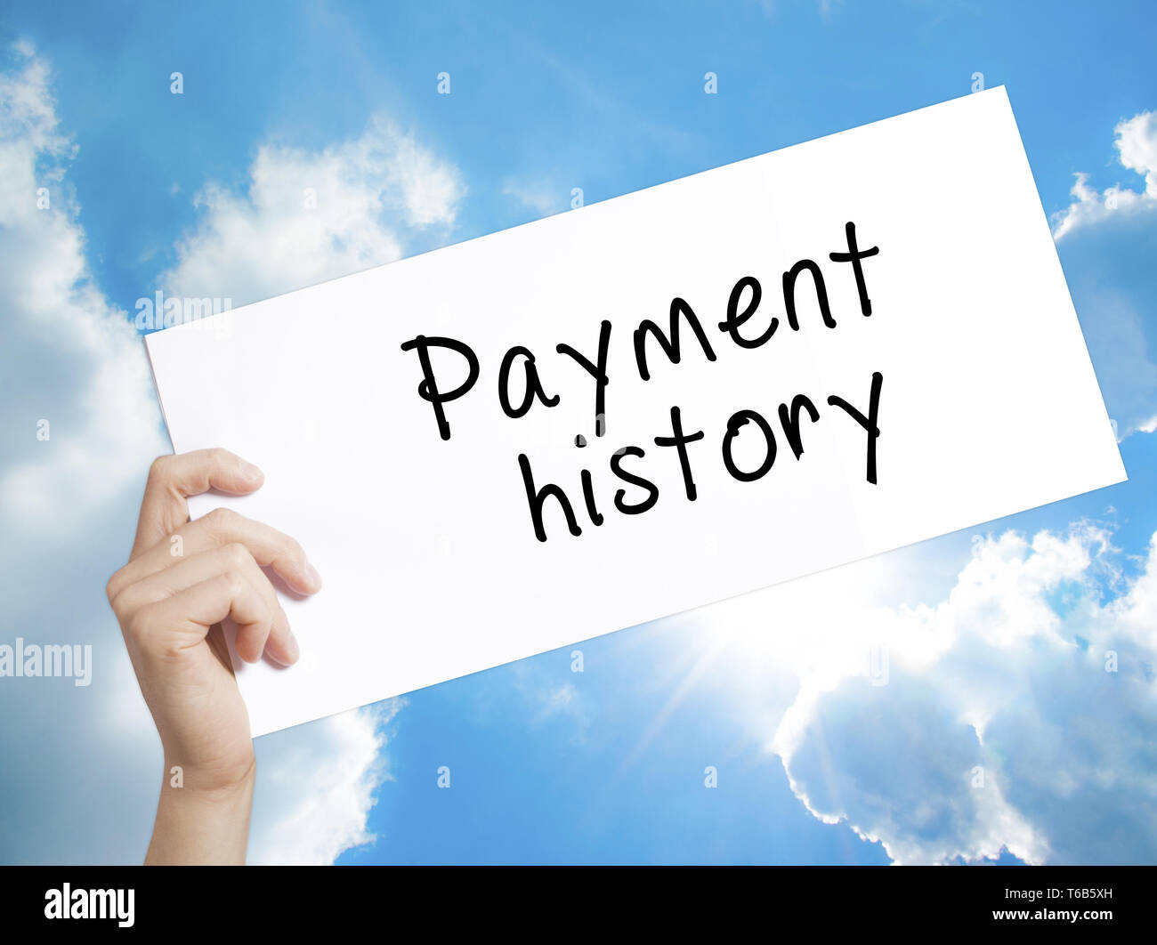 Payment history Sign on white paper. Man Hand Holding Paper with text ...