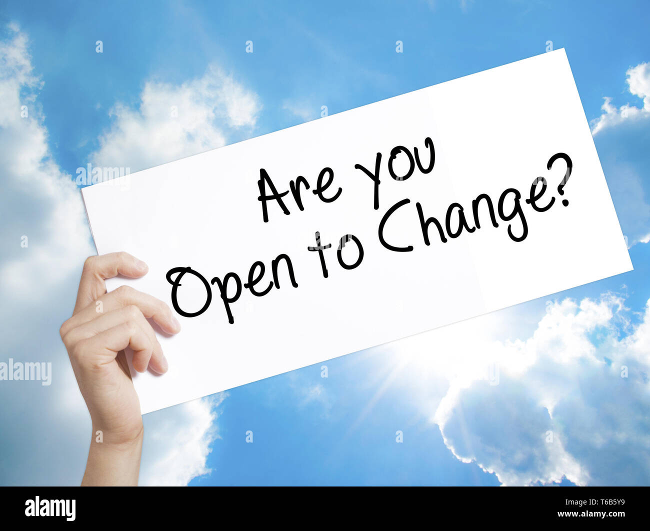 Are you Open to Change? Sign on white paper. Man Hand Holding Paper ...