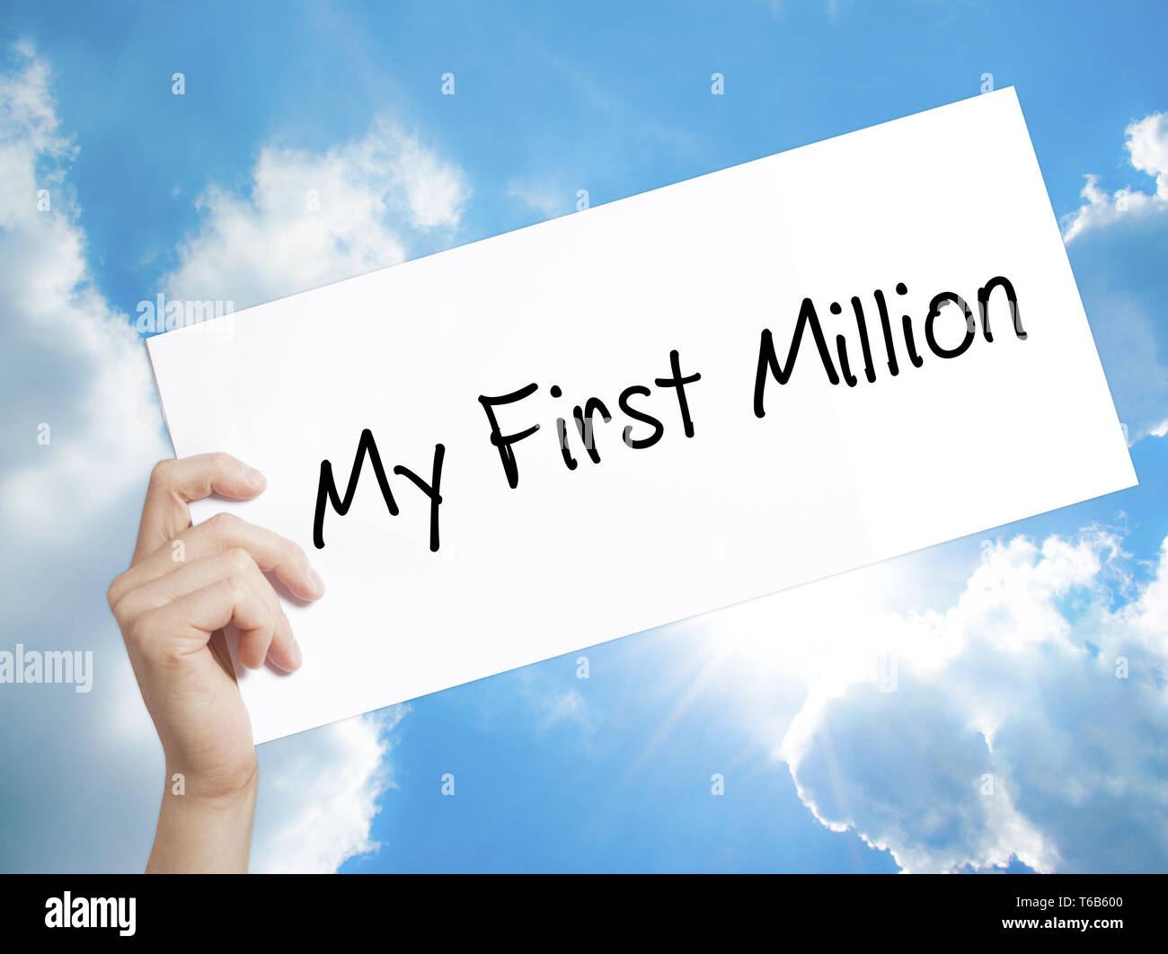 My First Million Sign on white paper. Man Hand Holding Paper with text ...