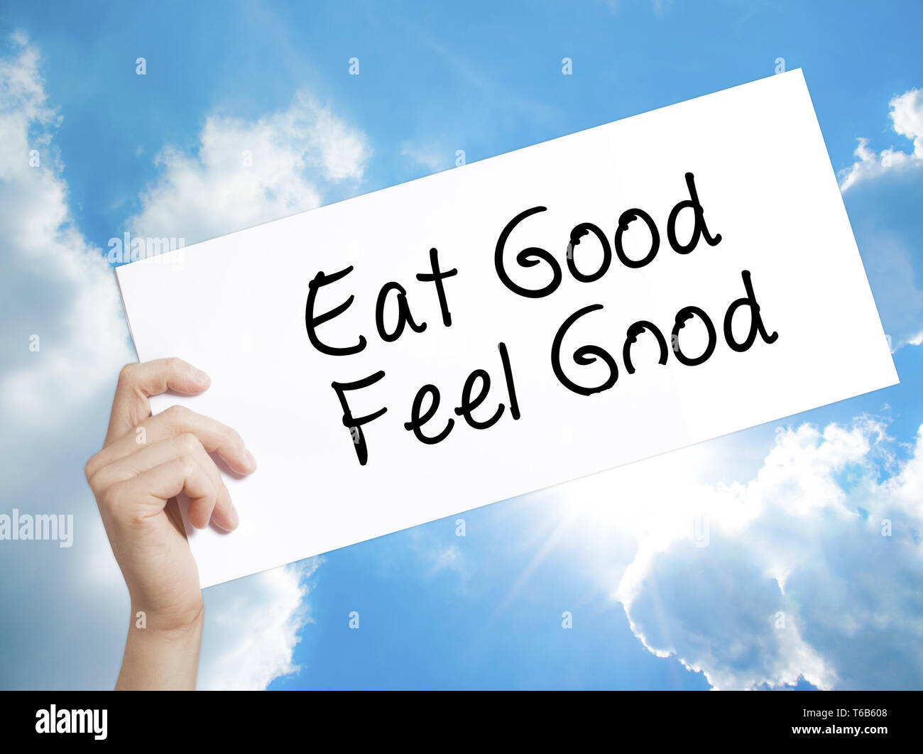Eat Good Feel Good Sign on white paper. Man Hand Holding Paper with ...