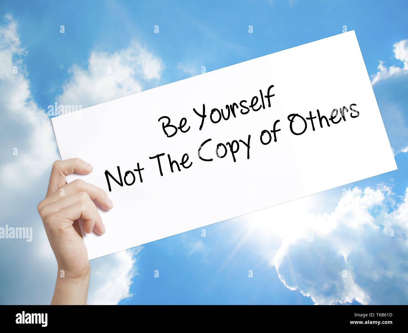 Be Yourself Not The Copy of Others Sign on white paper. Man Hand ...