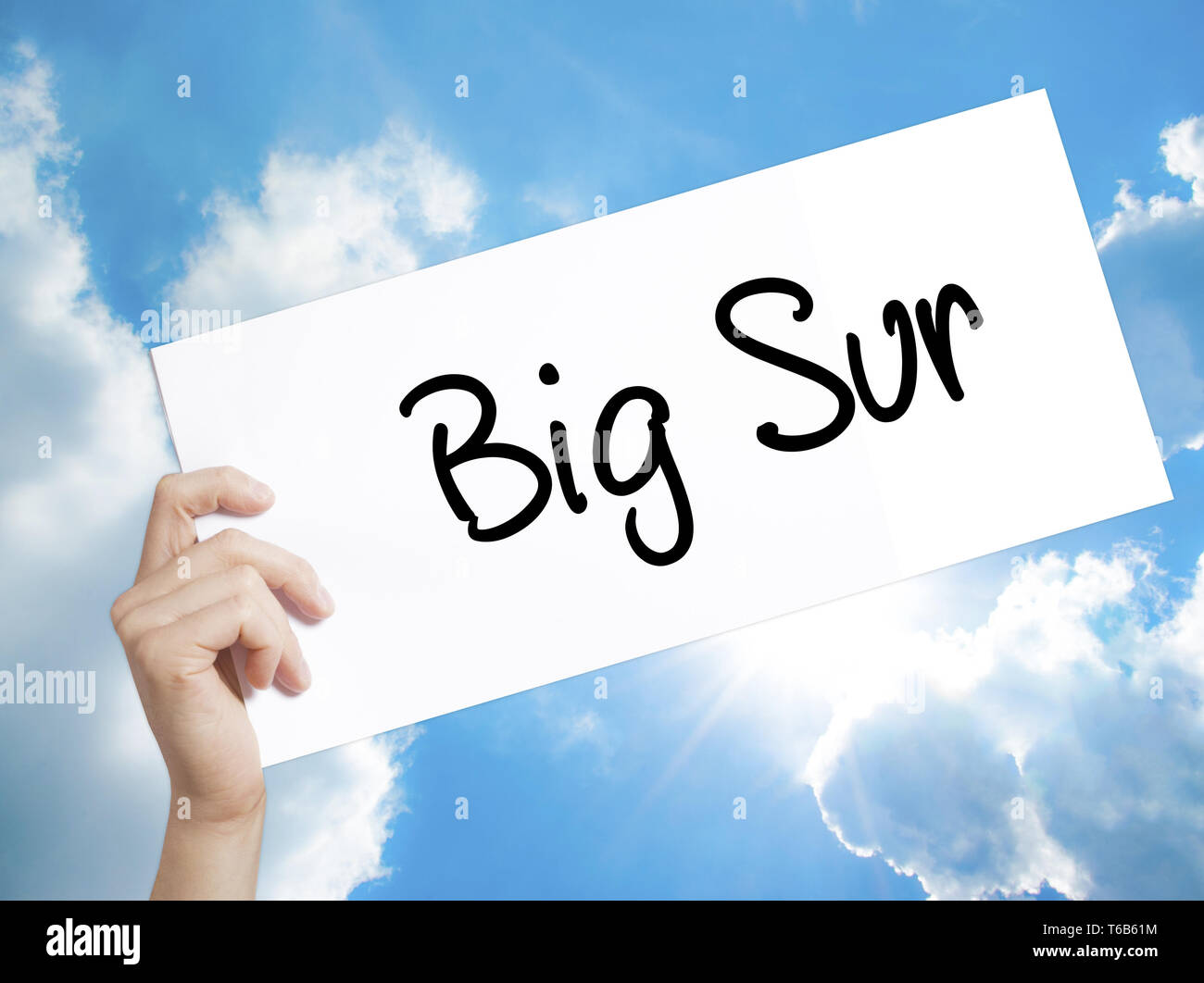 Big Sur Sign on white paper. Man Hand Holding Paper with text. Isolated ...