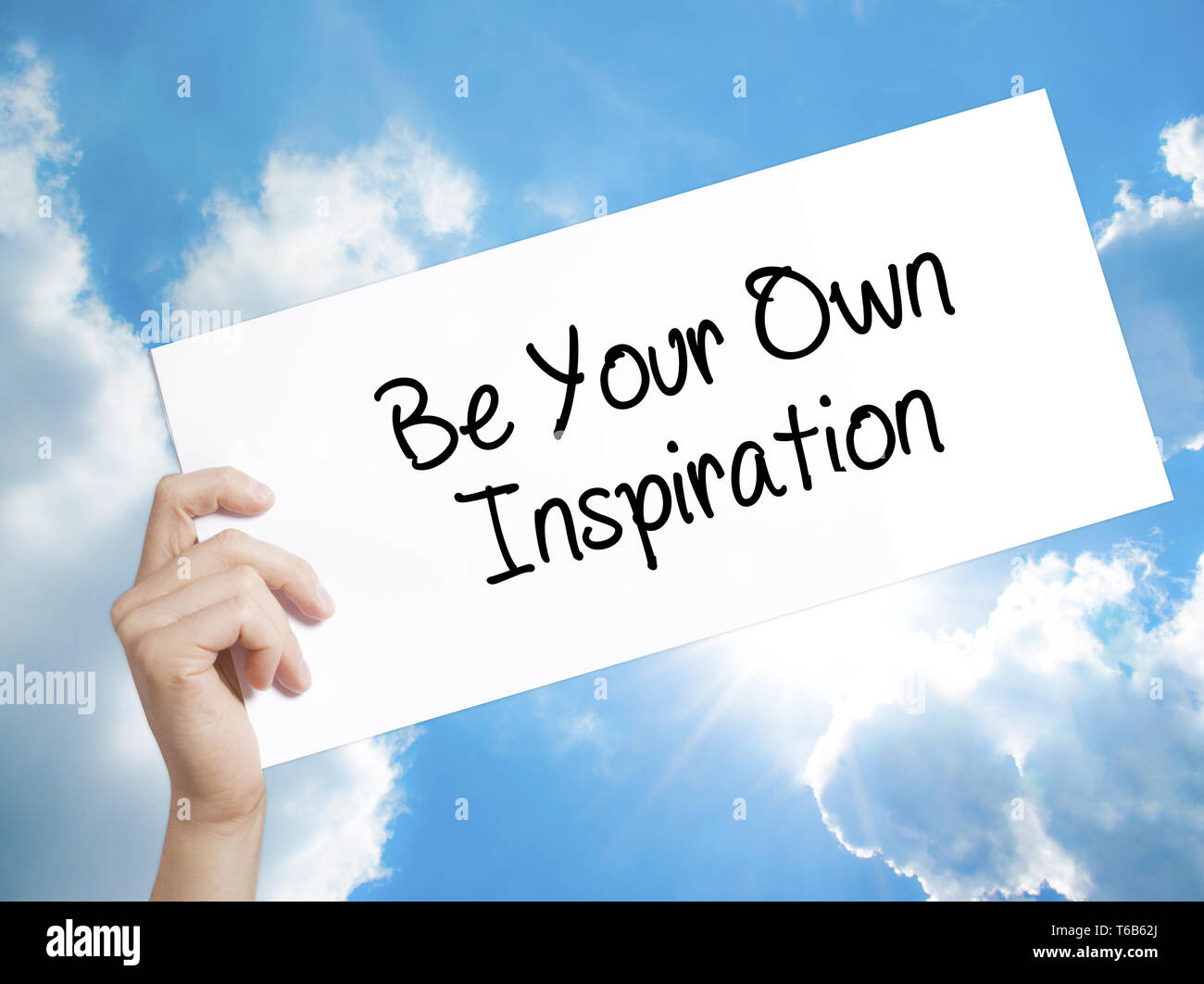 Be Your Own Inspiration Sign on white paper. Man Hand Holding Paper ...