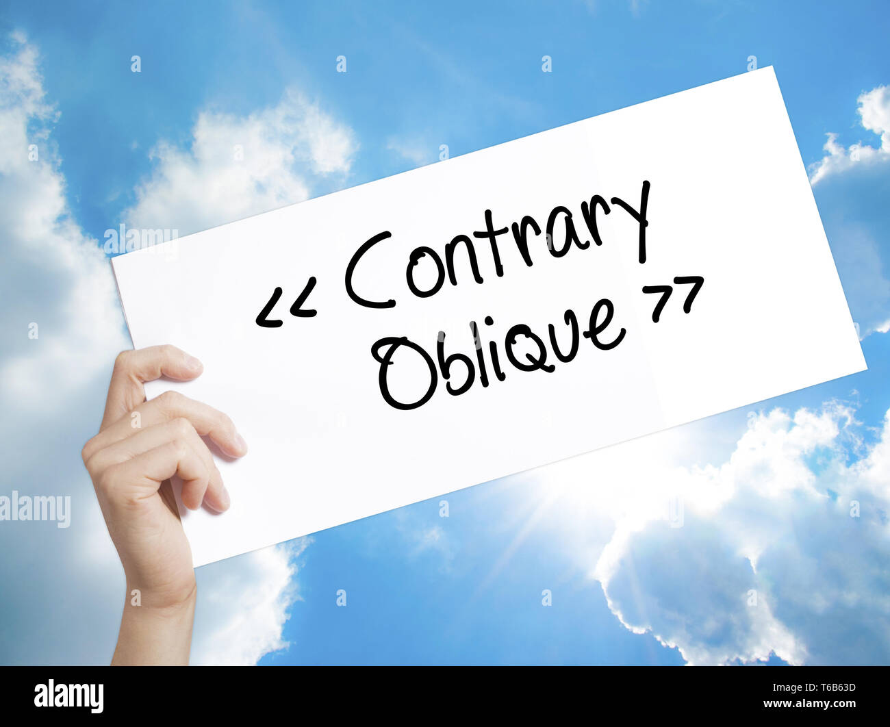 Contrary - Oblique Sign on white paper. Man Hand Holding Paper with ...