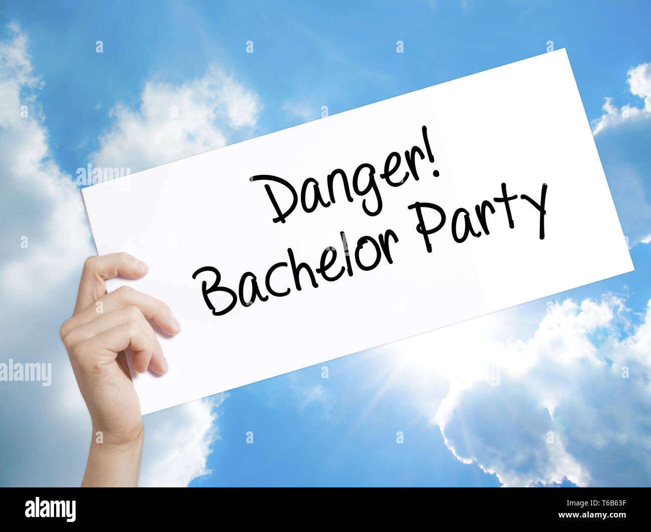 Danger! Bachelor Party Sign on white paper. Man Hand Holding Paper with ...