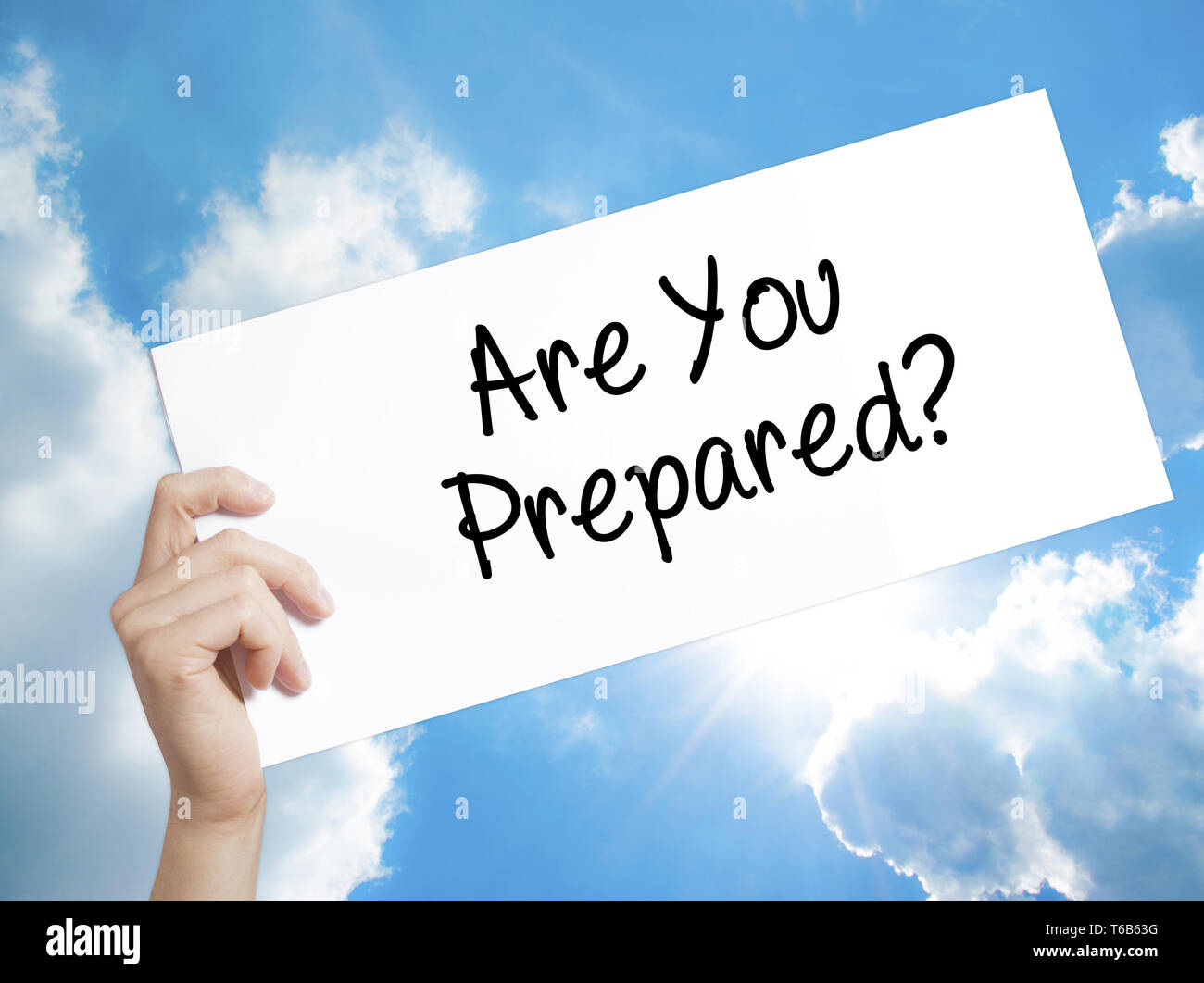 Are you Prepared? Sign on white paper. Man Hand Holding Paper with text ...