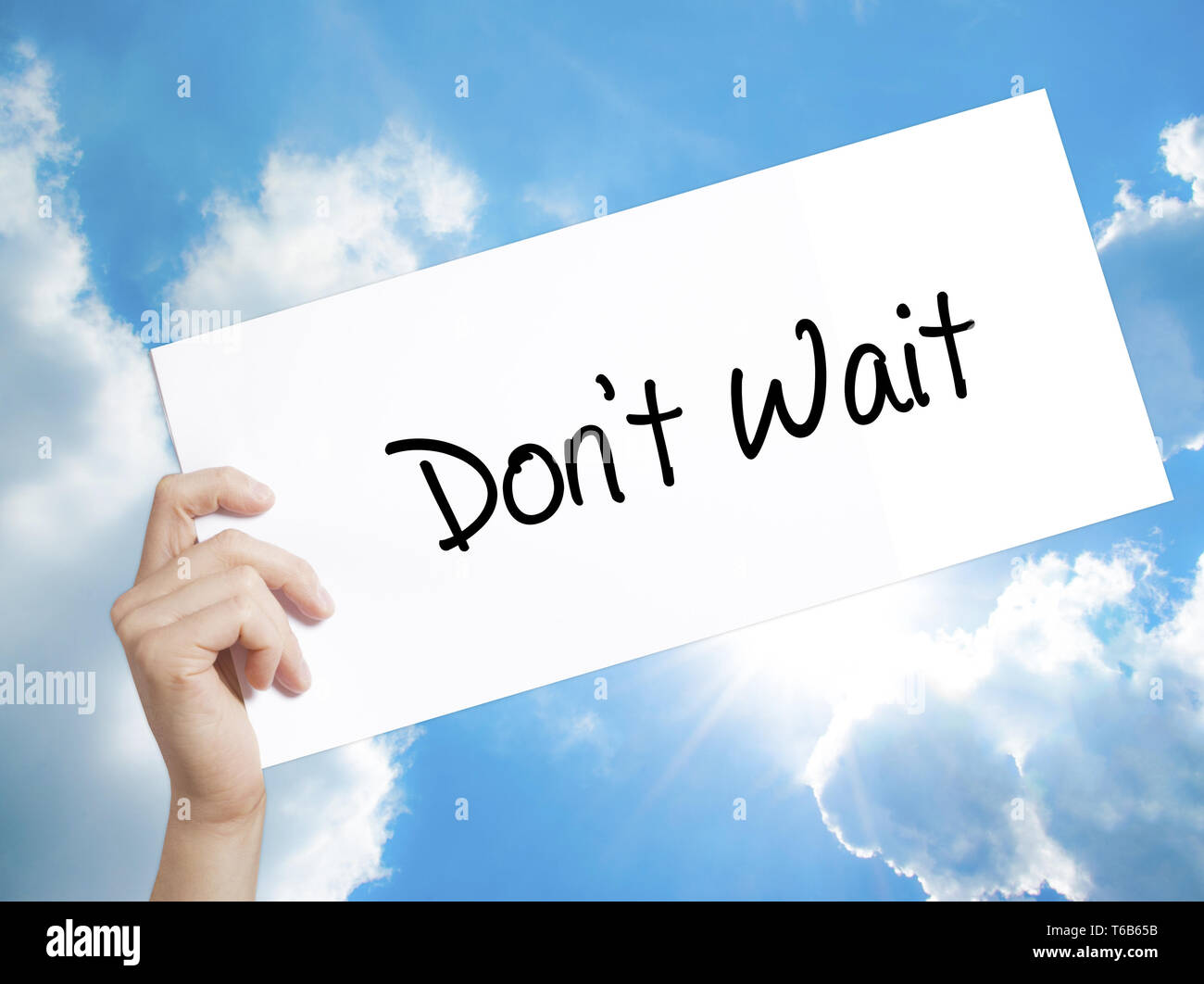 Don't Wait Sign on white paper. Man Hand Holding Paper with text ...