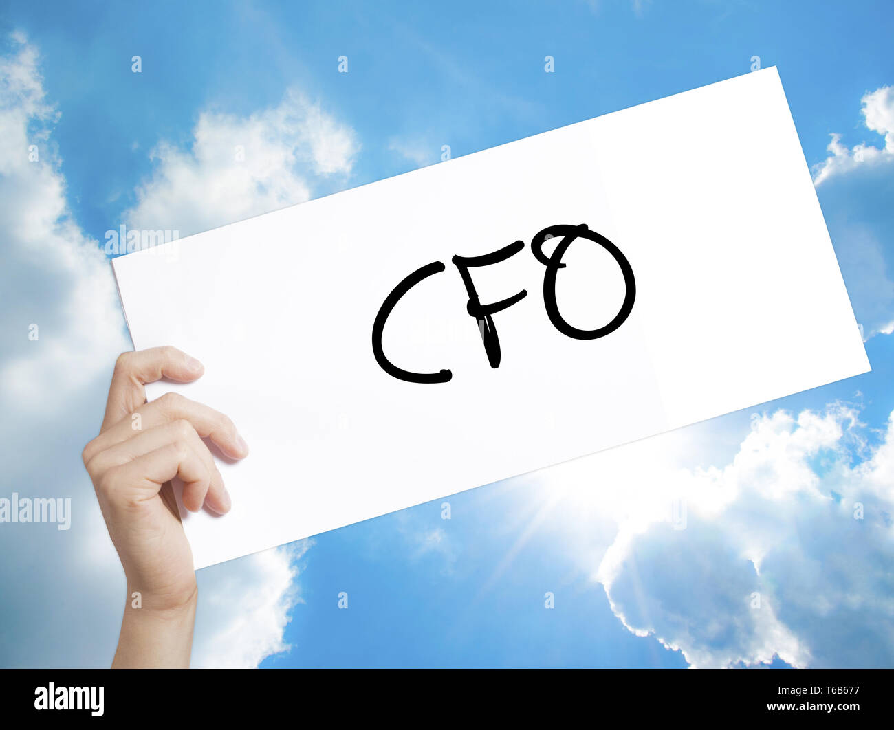 CFO (Chief Financial Officer) Sign on white paper. Man Hand Holding ...
