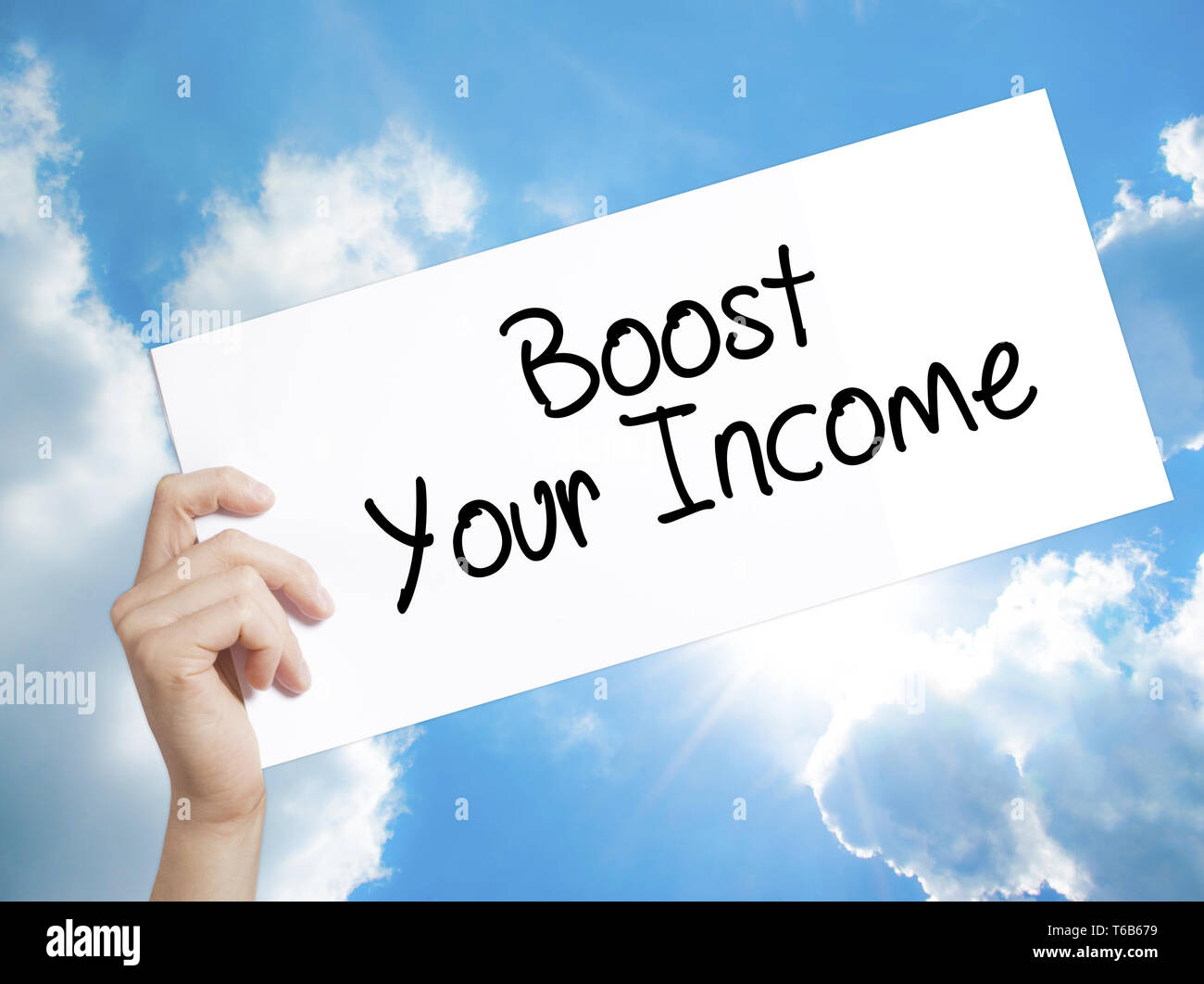 Boost Your Income Sign on white paper. Man Hand Holding Paper with text ...