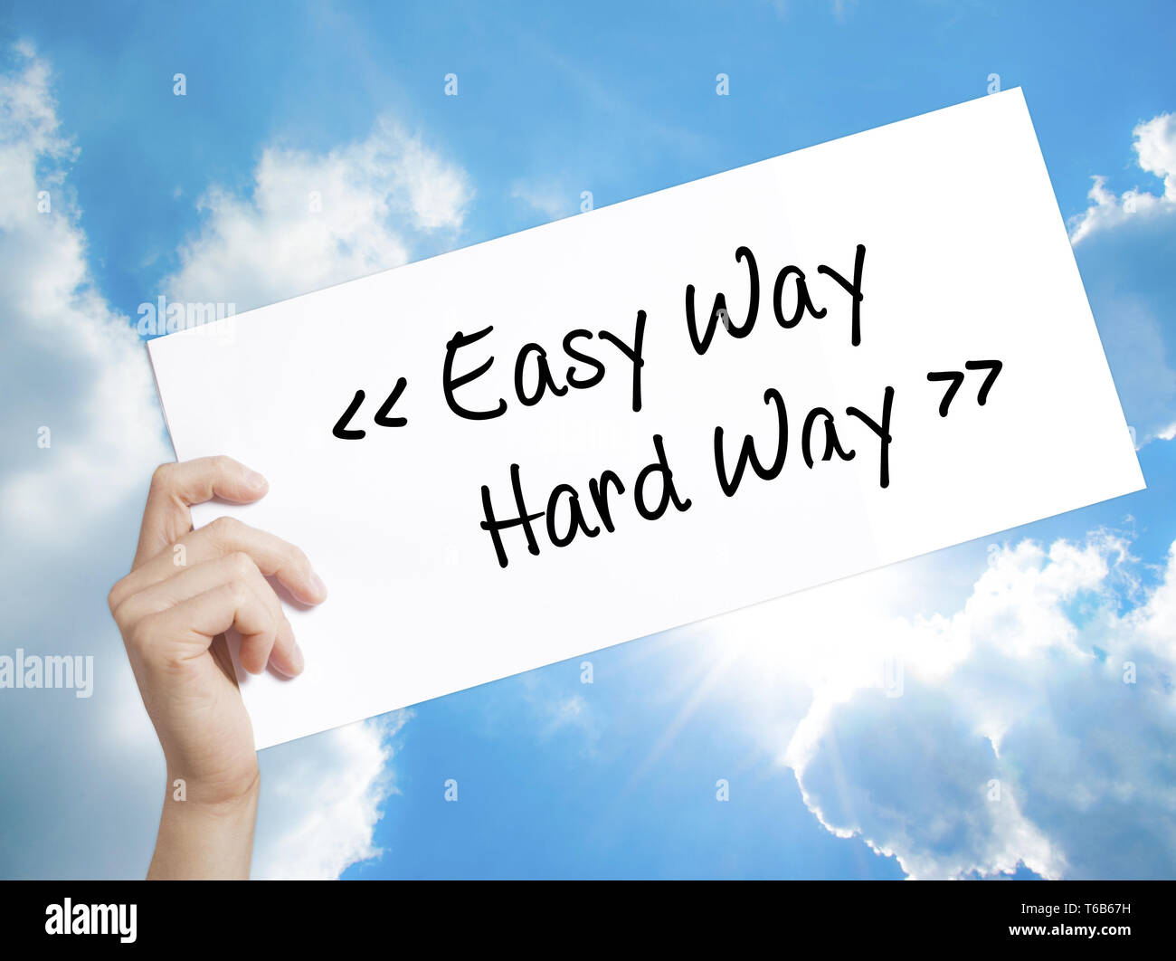 Easy Way - Hard Way Sign on white paper. Man Hand Holding Paper with ...