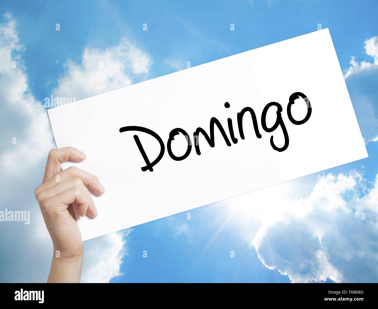 Domingo (Sunday in Spanish/Portuguese) Sign on white paper. Man Hand ...