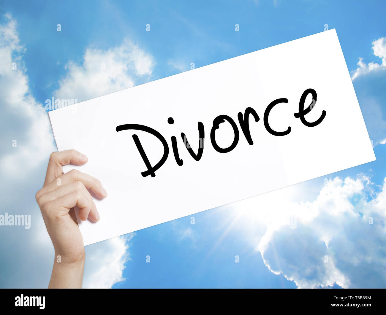 Divorce Sign on white paper. Man Hand Holding Paper with text. Isolated ...