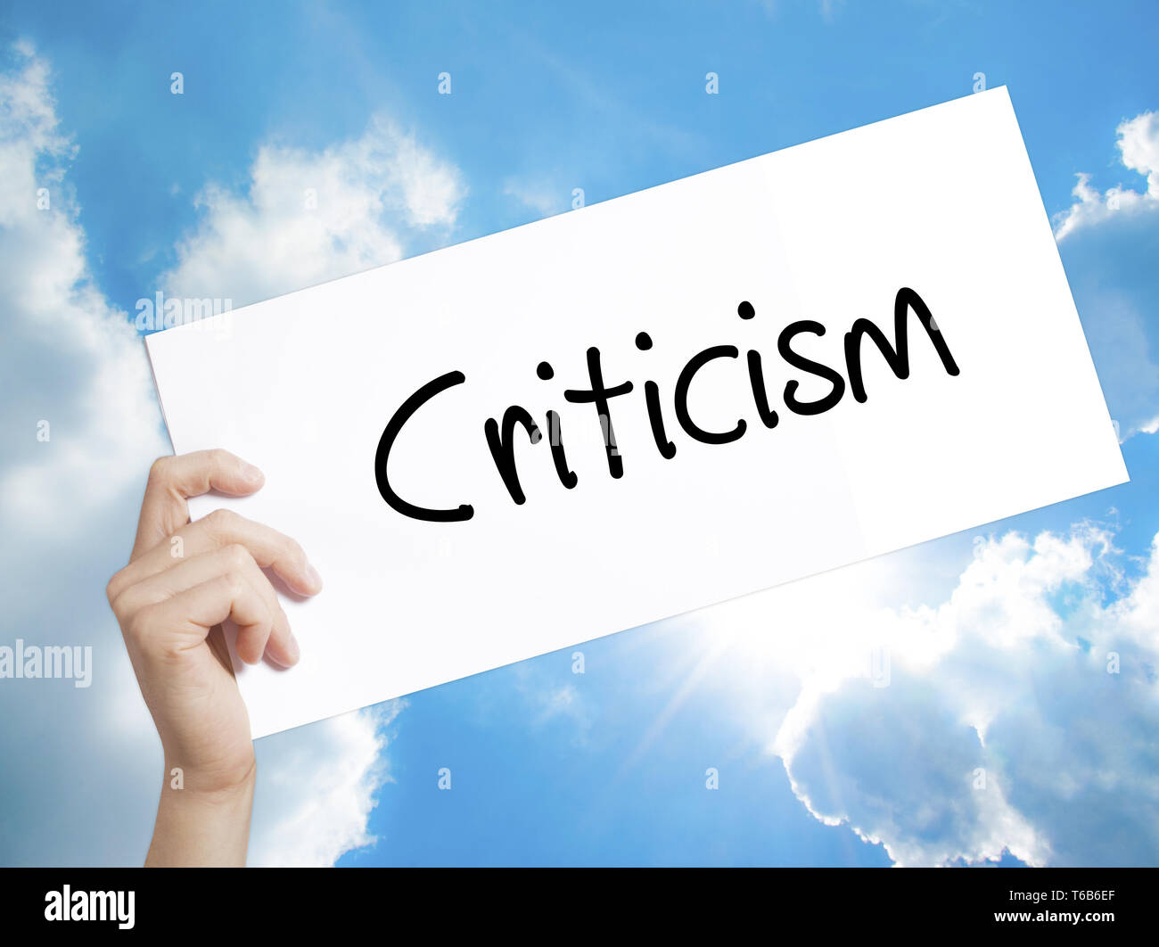 Criticism Sign on white paper. Man Hand Holding Paper with text ...