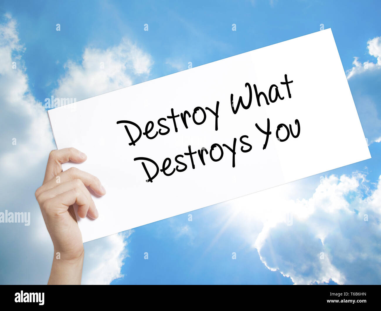 Destroy What Destroys You Sign on white paper. Man Hand Holding Paper ...