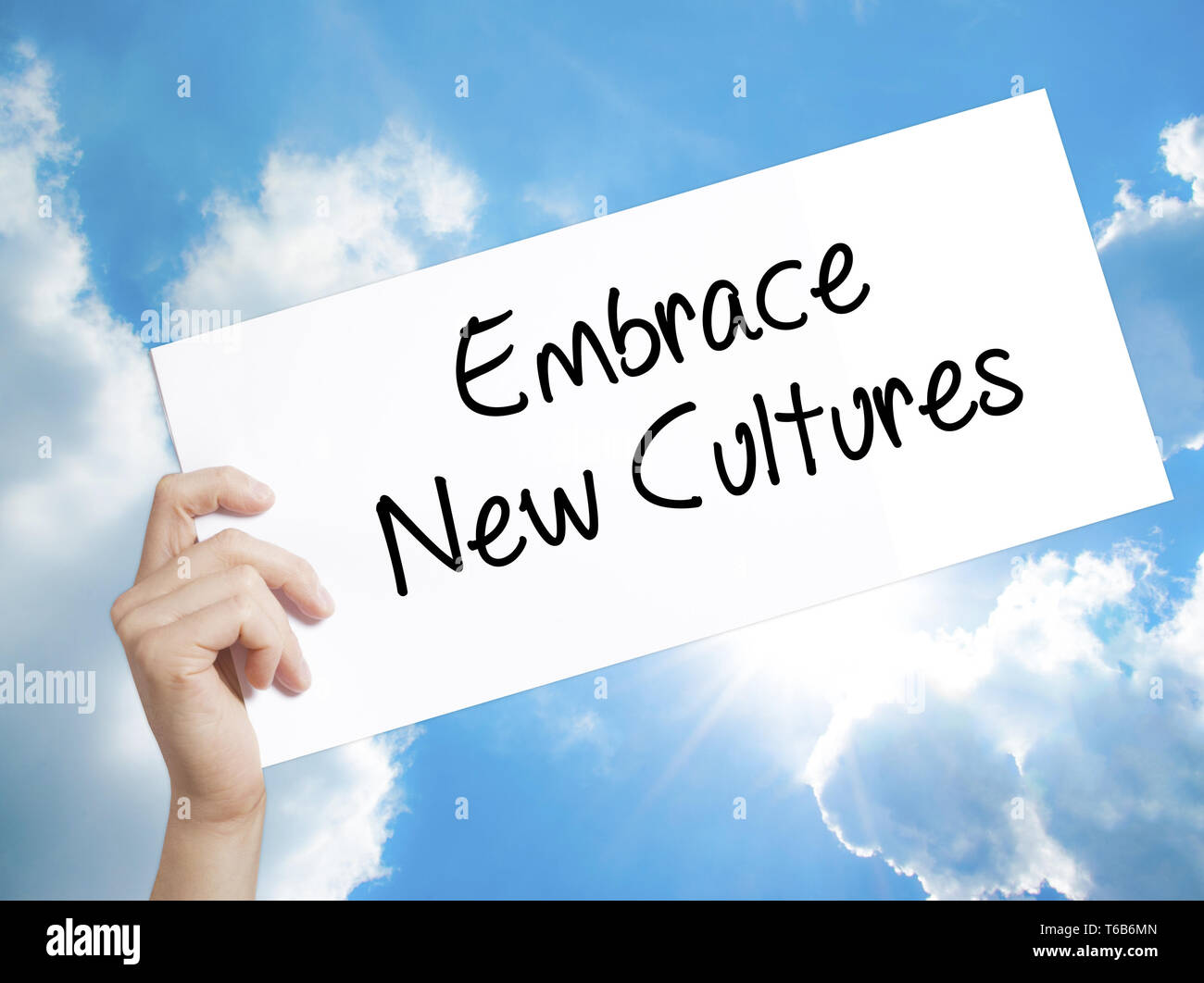 Embrace New Cultures Sign on white paper. Man Hand Holding Paper with ...