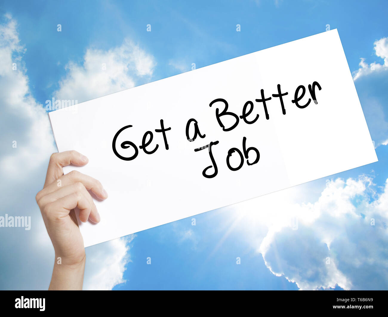 Get a Better Job Sign on white paper. Man Hand Holding Paper with text ...