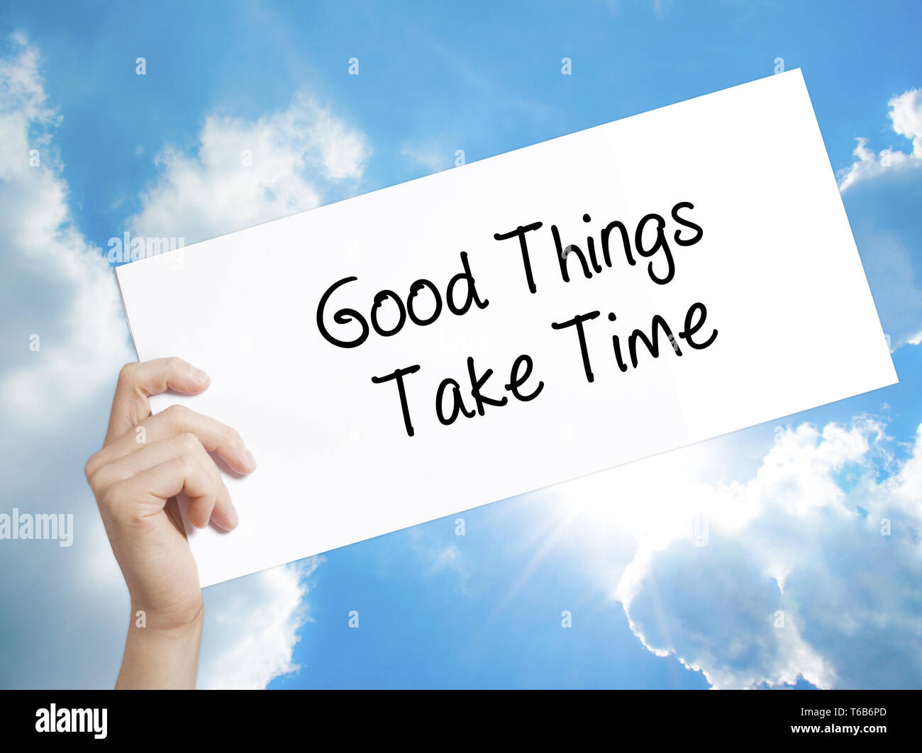 Good Things Take Time Sign on white paper. Man Hand Holding Paper with ...