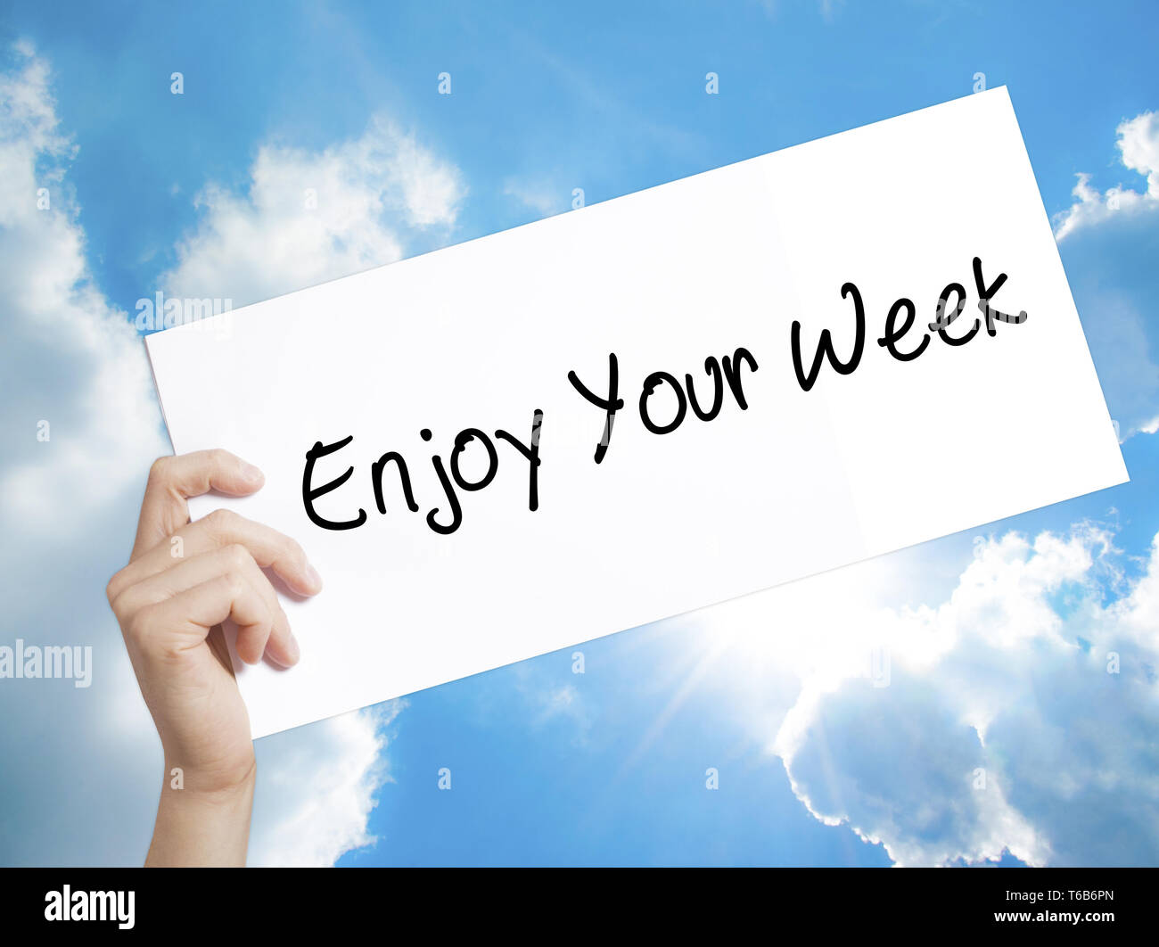 Enjoy Your Week Sign on white paper. Man Hand Holding Paper with text ...