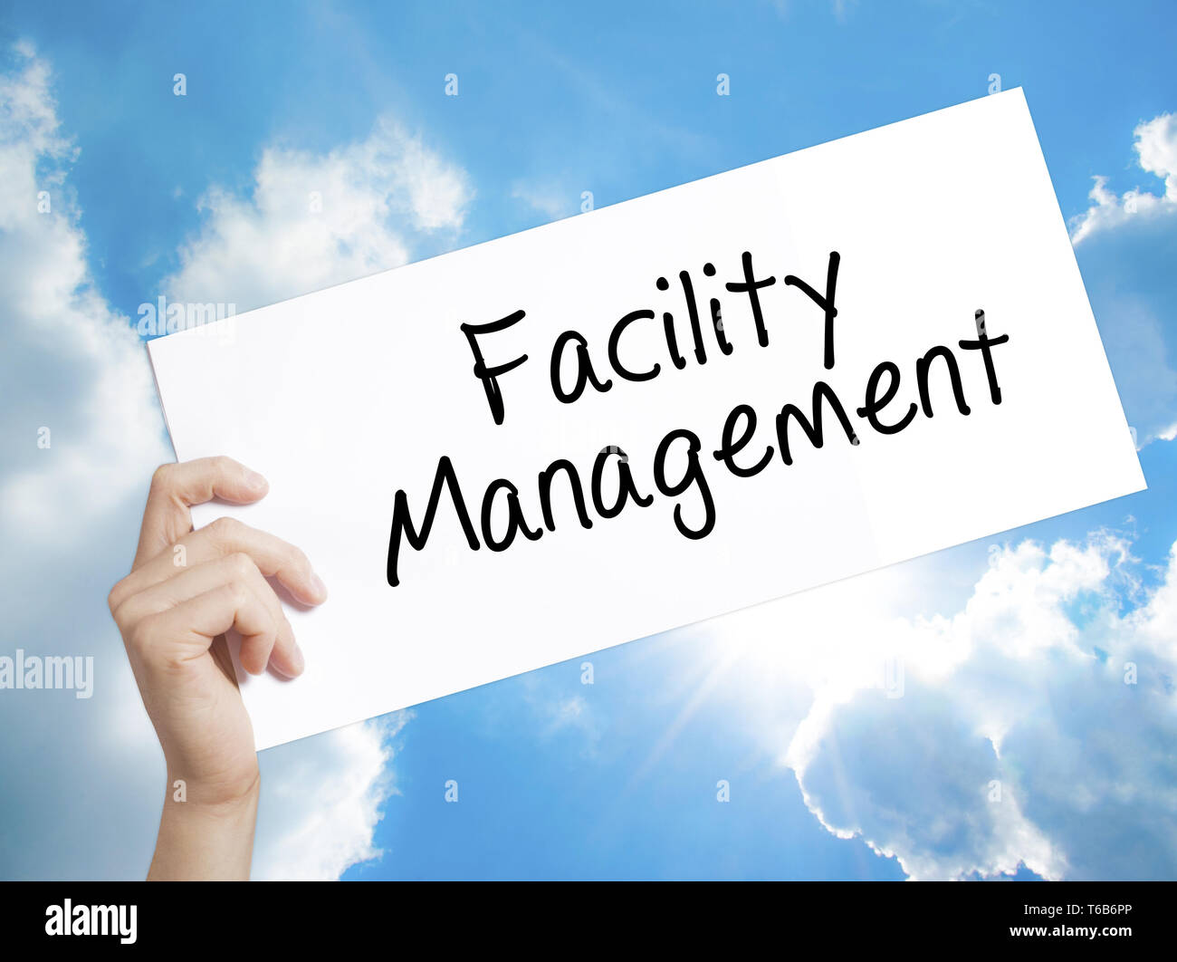 Facility Management Sign on white paper. Man Hand Holding Paper with ...