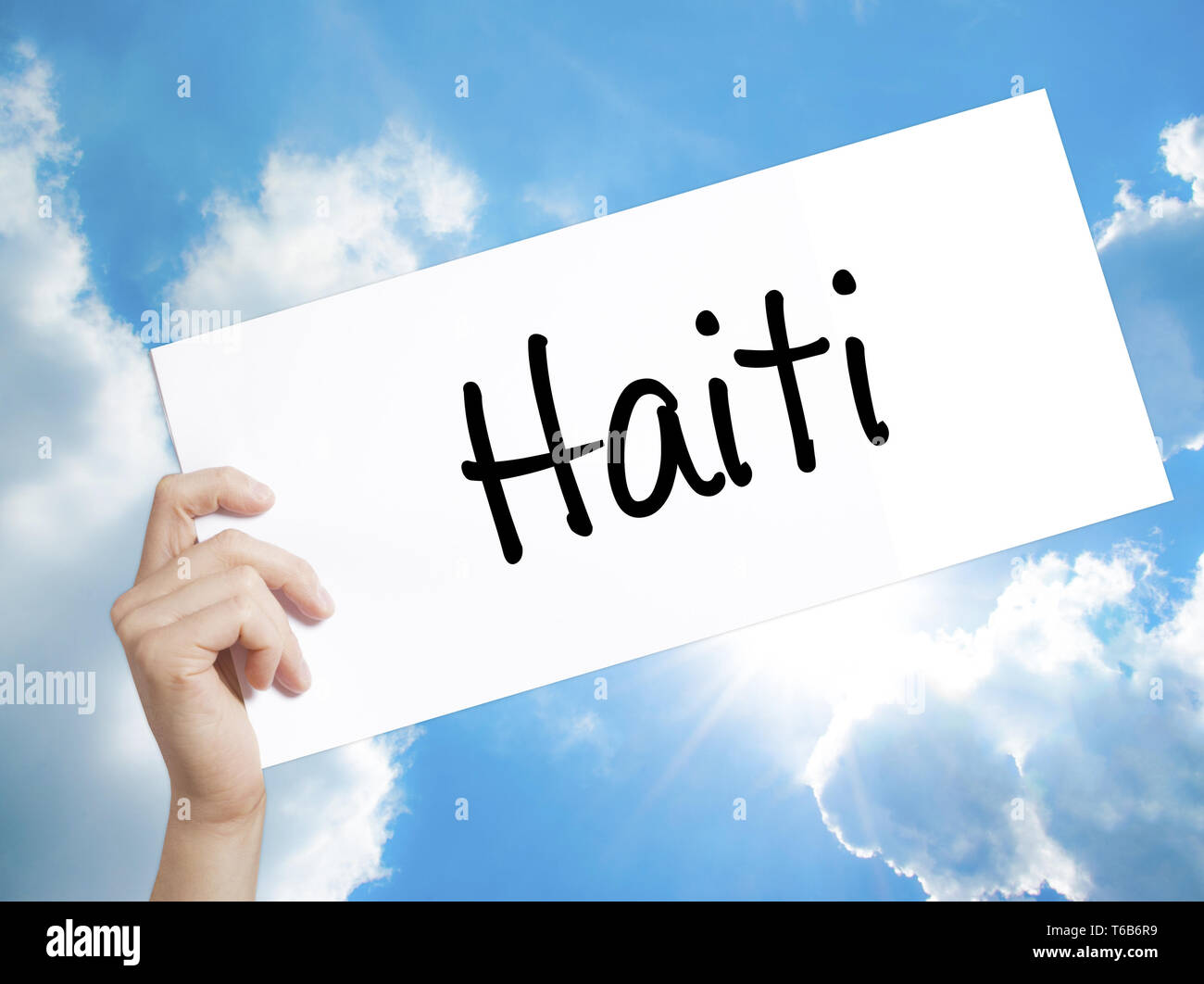 Haiti Sign on white paper. Man Hand Holding Paper with text. Isolated ...