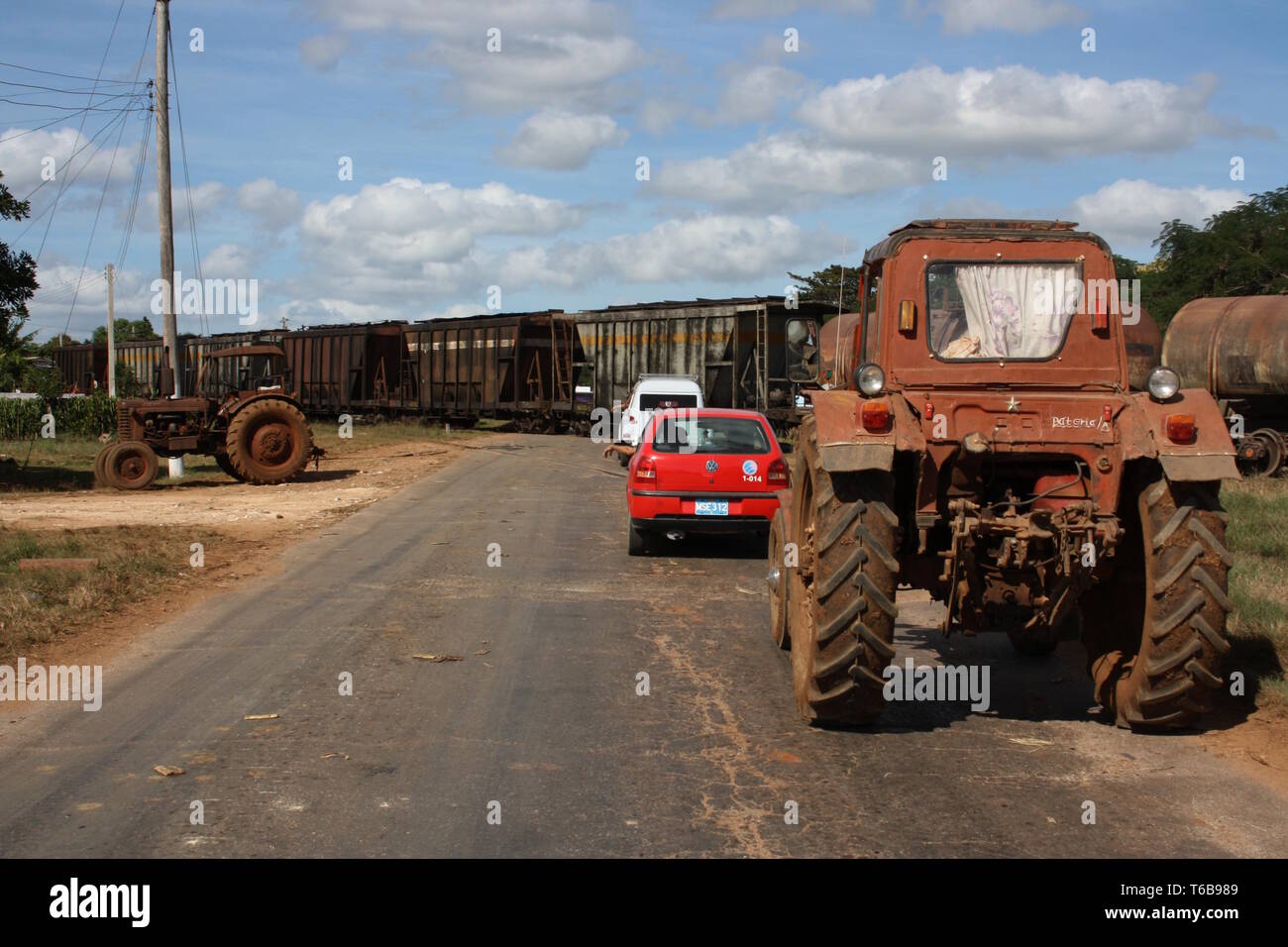 Cuba, railroadcrossing with train and farm tractors Stock Photo - Alamy