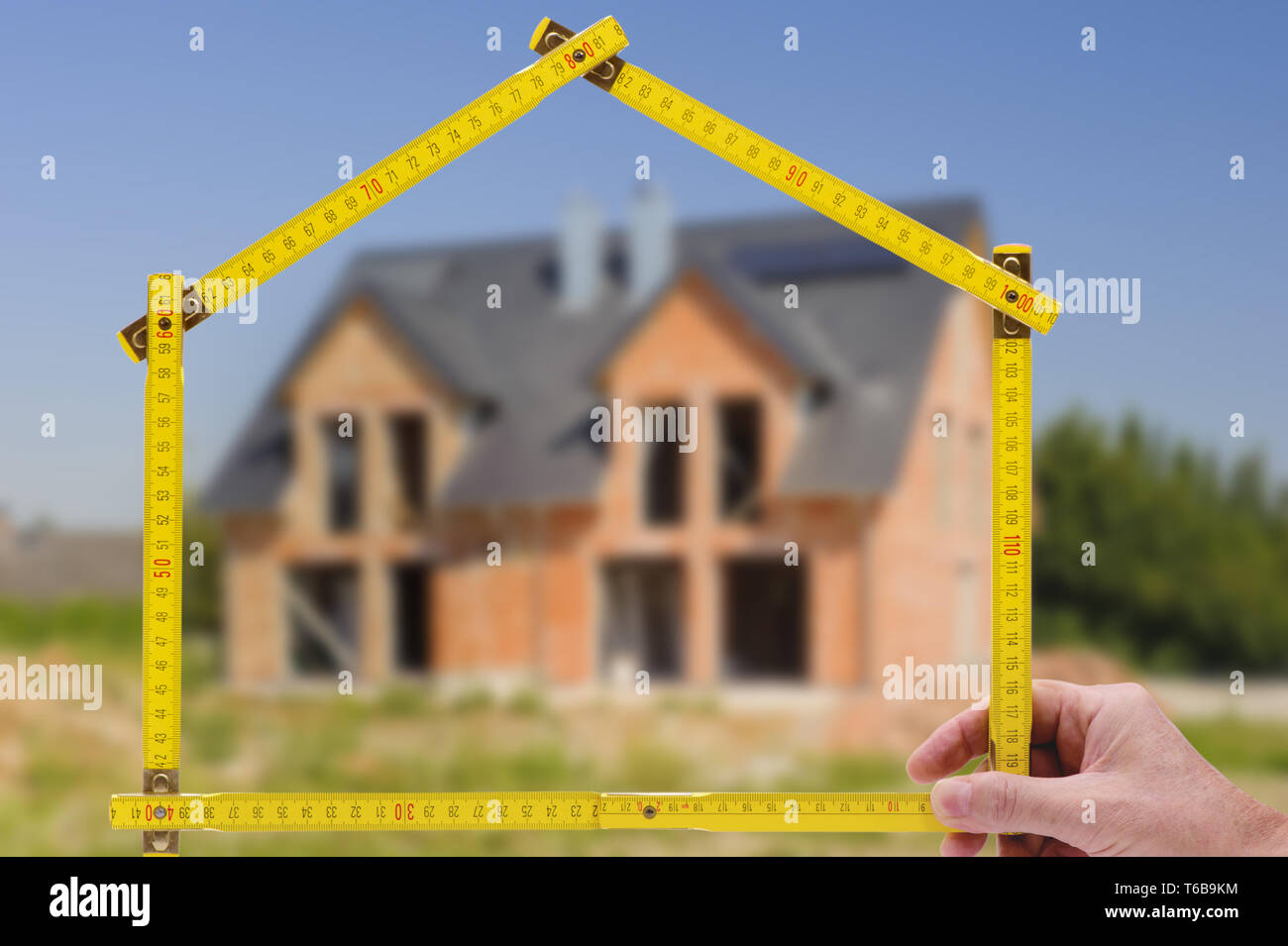 Construction folding ruler house shape hi-res stock photography and ...