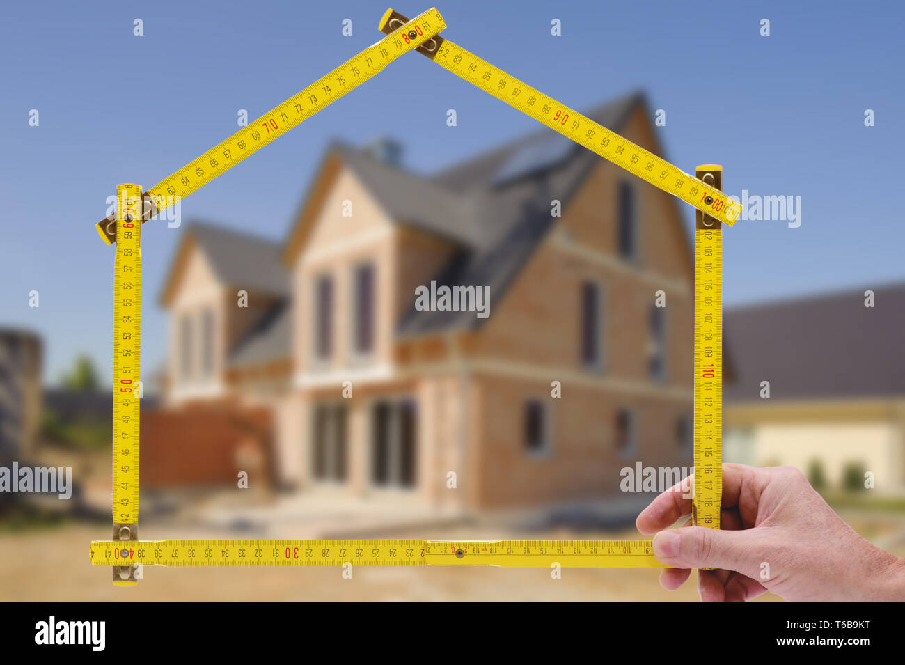Construction folding ruler house shape hi-res stock photography and ...