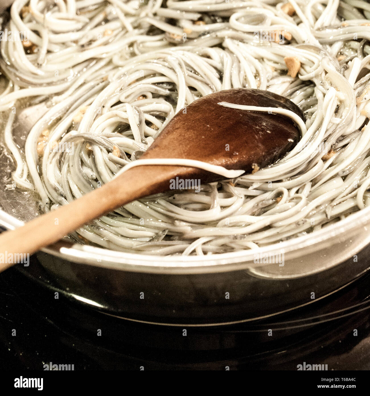 Traditional Basque meal - baby eel fried with garlic in olive oil Stock ...
