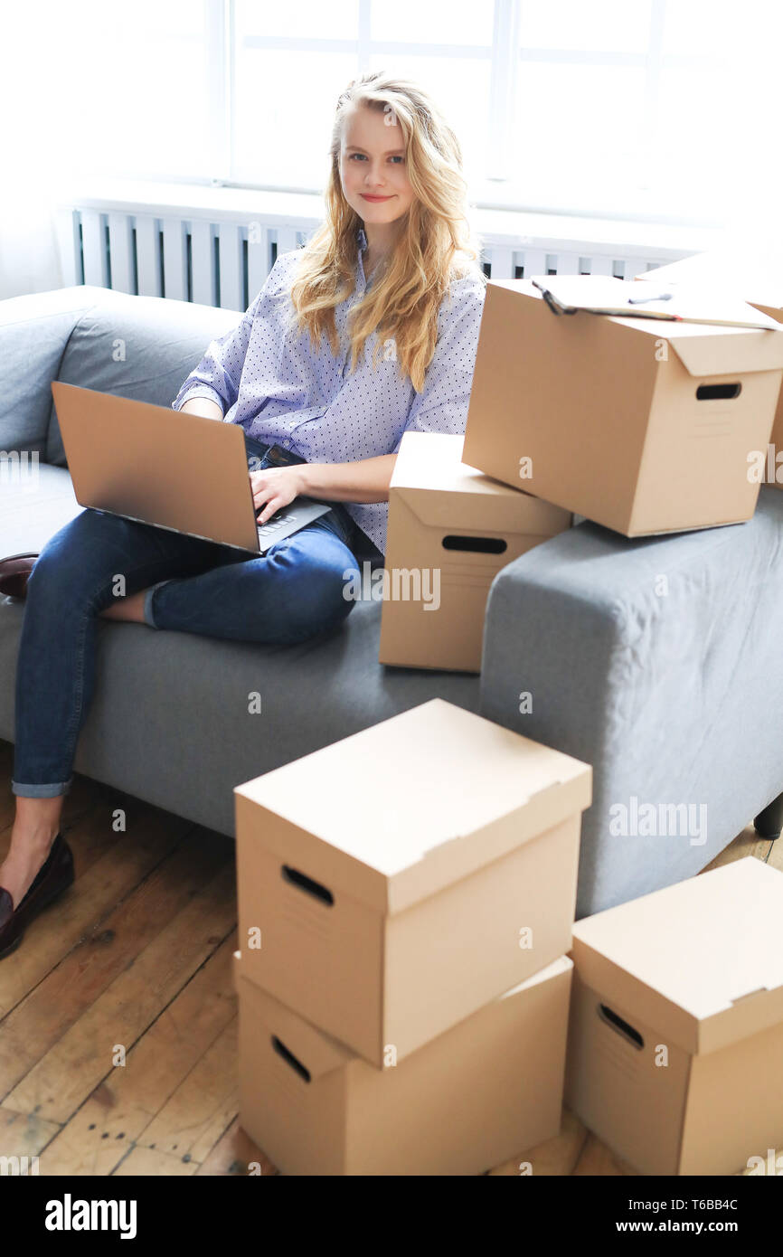 Girl is moving to new home Stock Photo - Alamy