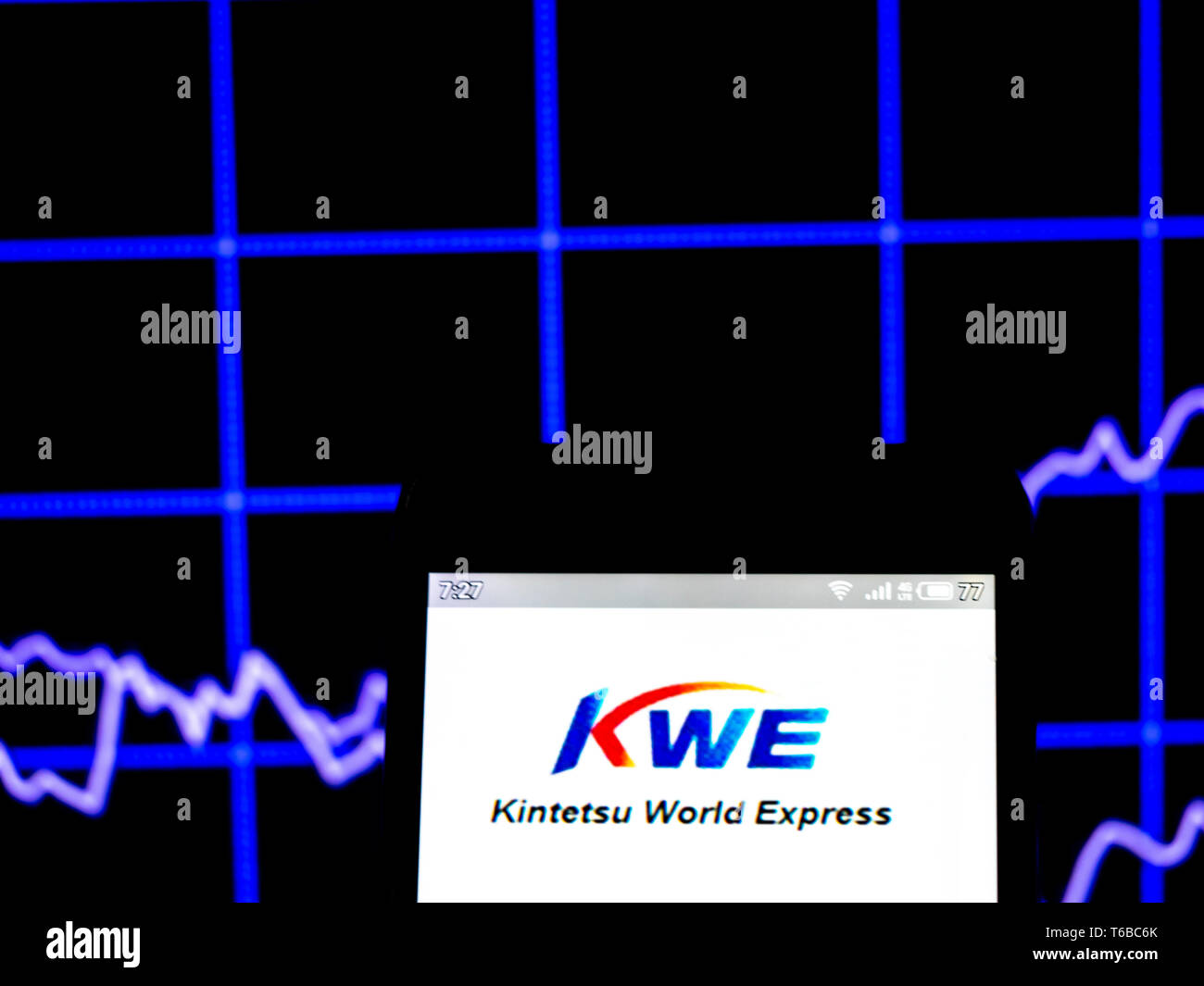 In this photo illustration a Kintetsu World Express, Inc. (KWE) logo seen displayed on a smart ...