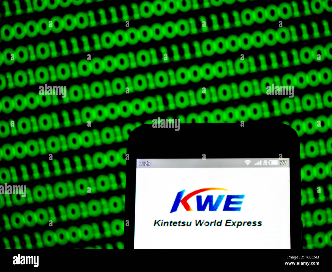 In this photo illustration a Kintetsu World Express, Inc. (KWE) logo ...