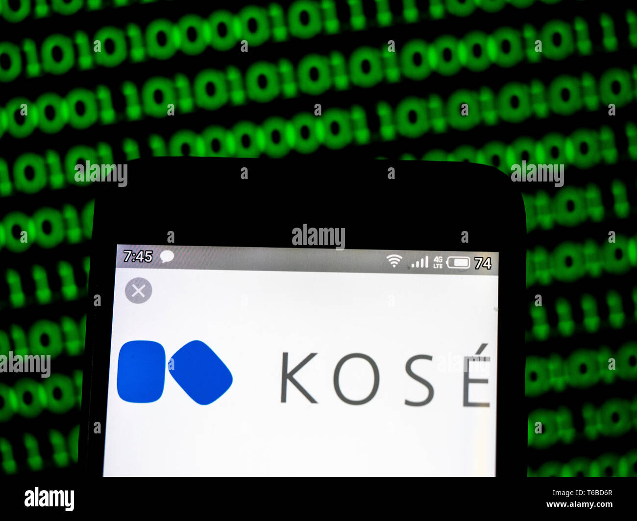 In this photo illustration a Kose Corporation logo seen displayed on a ...