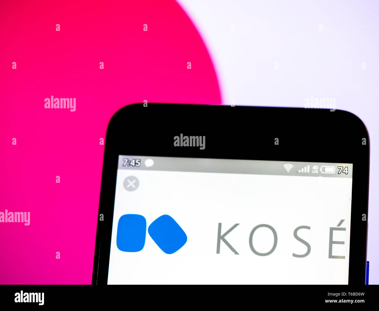 In this photo illustration a Kose Corporation logo seen displayed on a ...