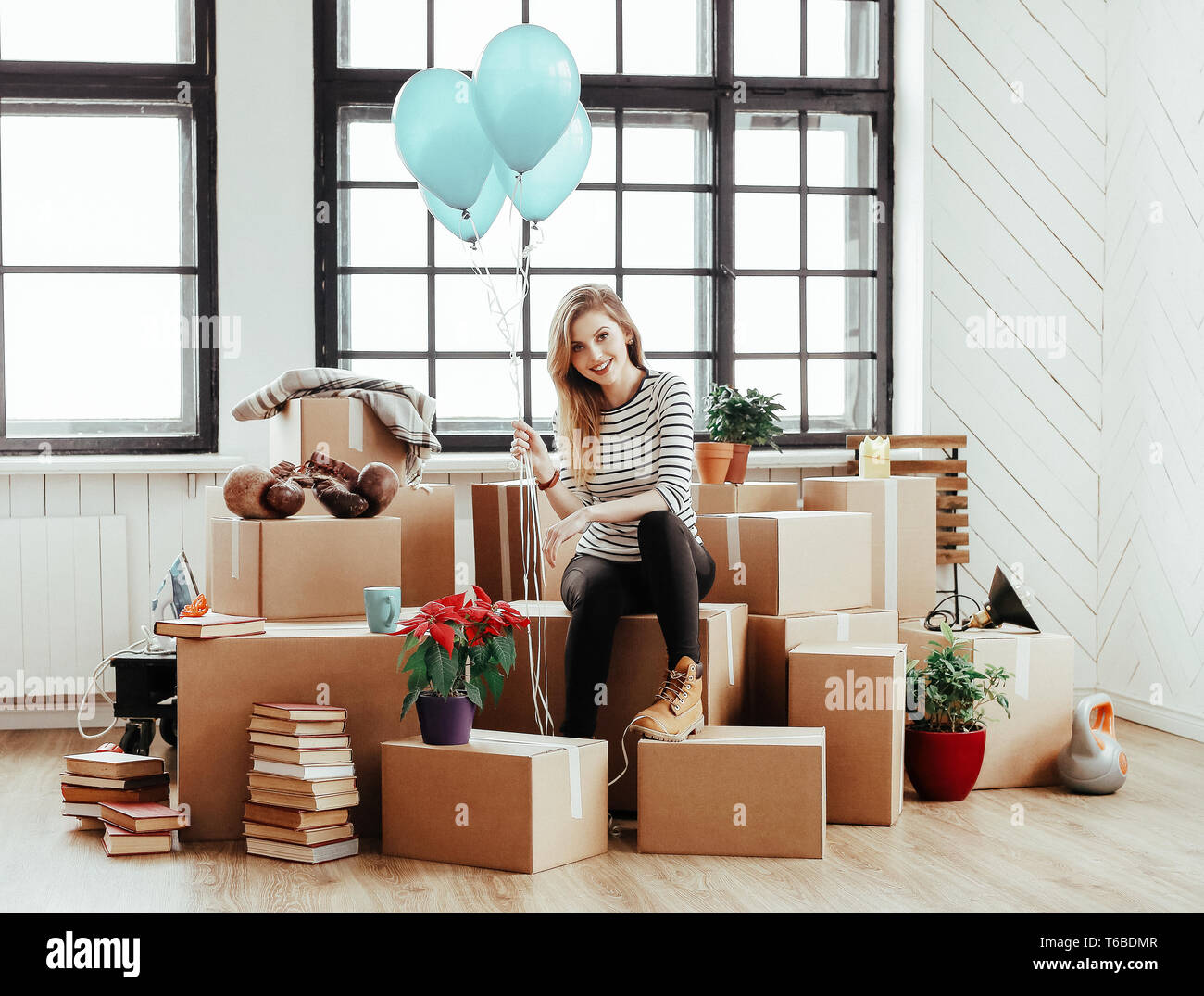 Girl is moving to new home Stock Photo - Alamy