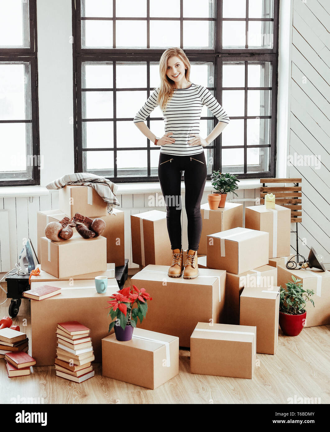 Girl is moving to new home Stock Photo - Alamy