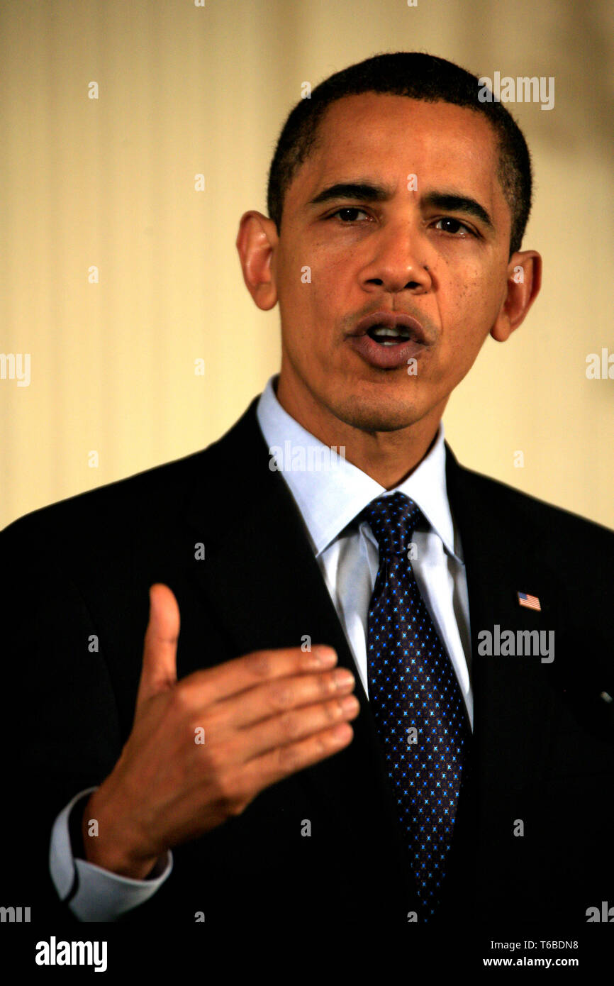 The President of the United States, Barack Obama, signs into law ...