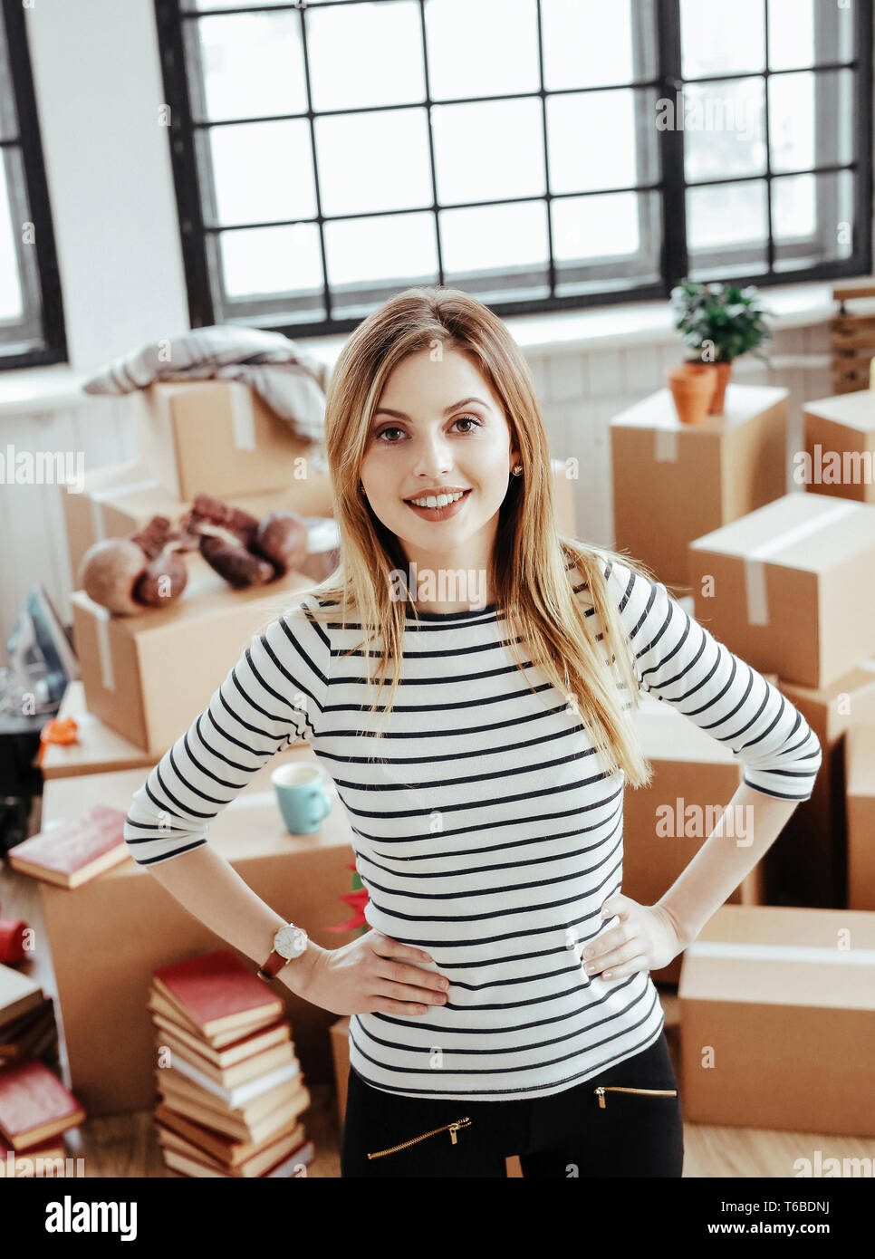 Girl is moving to new home Stock Photo - Alamy