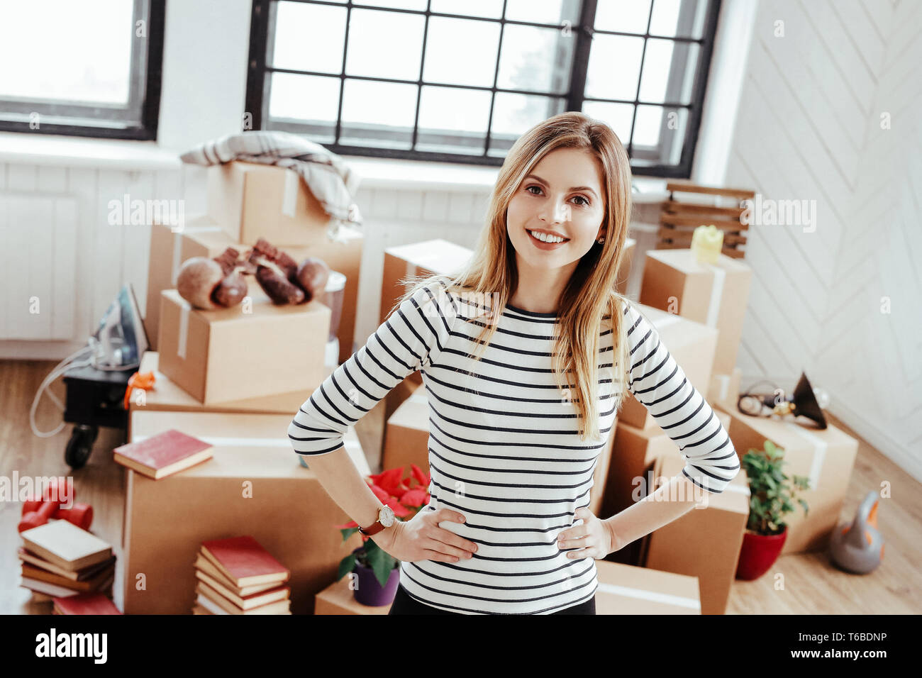 Girl is moving to new home Stock Photo - Alamy