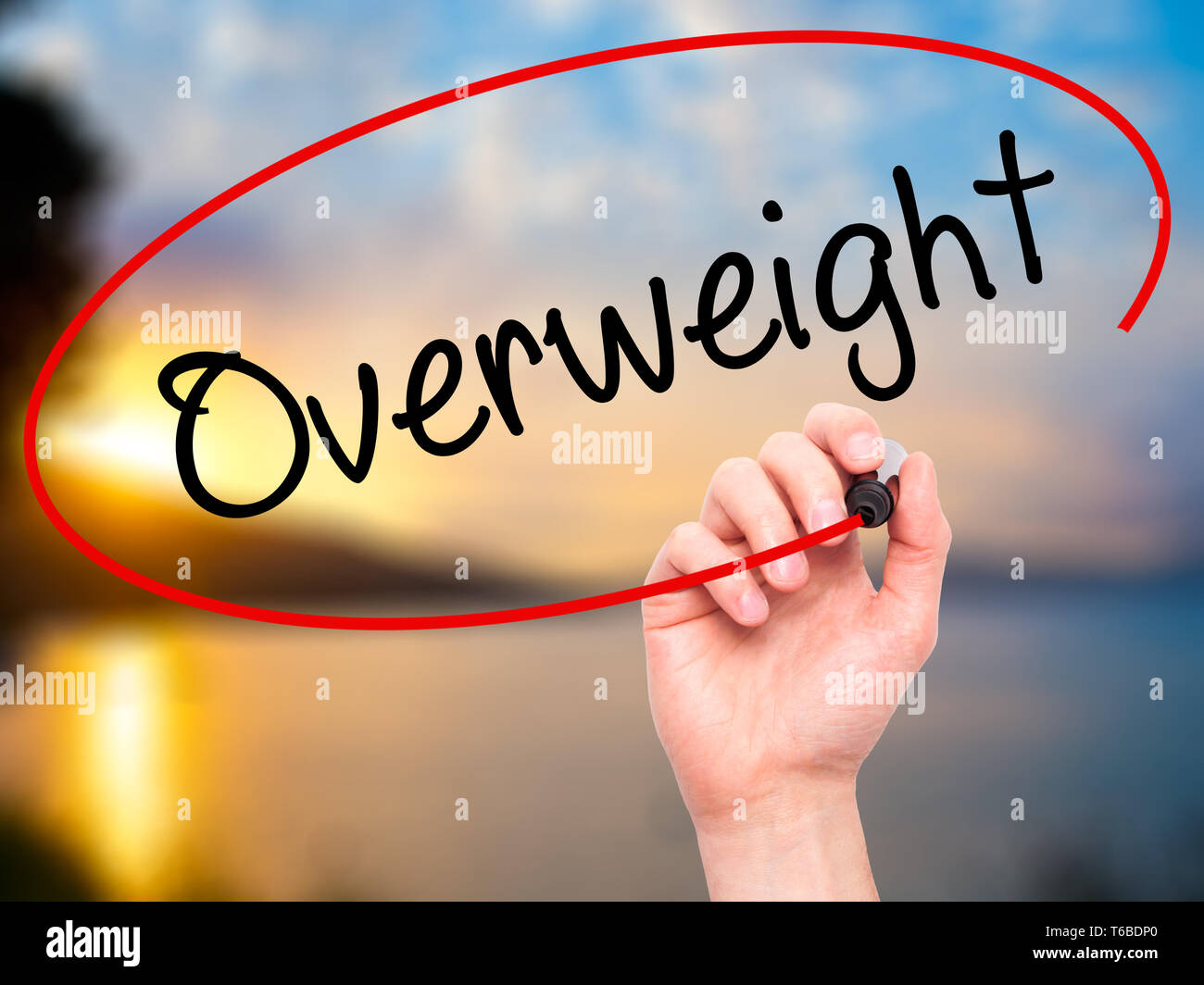 Man Hand writing Overweight with black marker on visual screen Stock ...