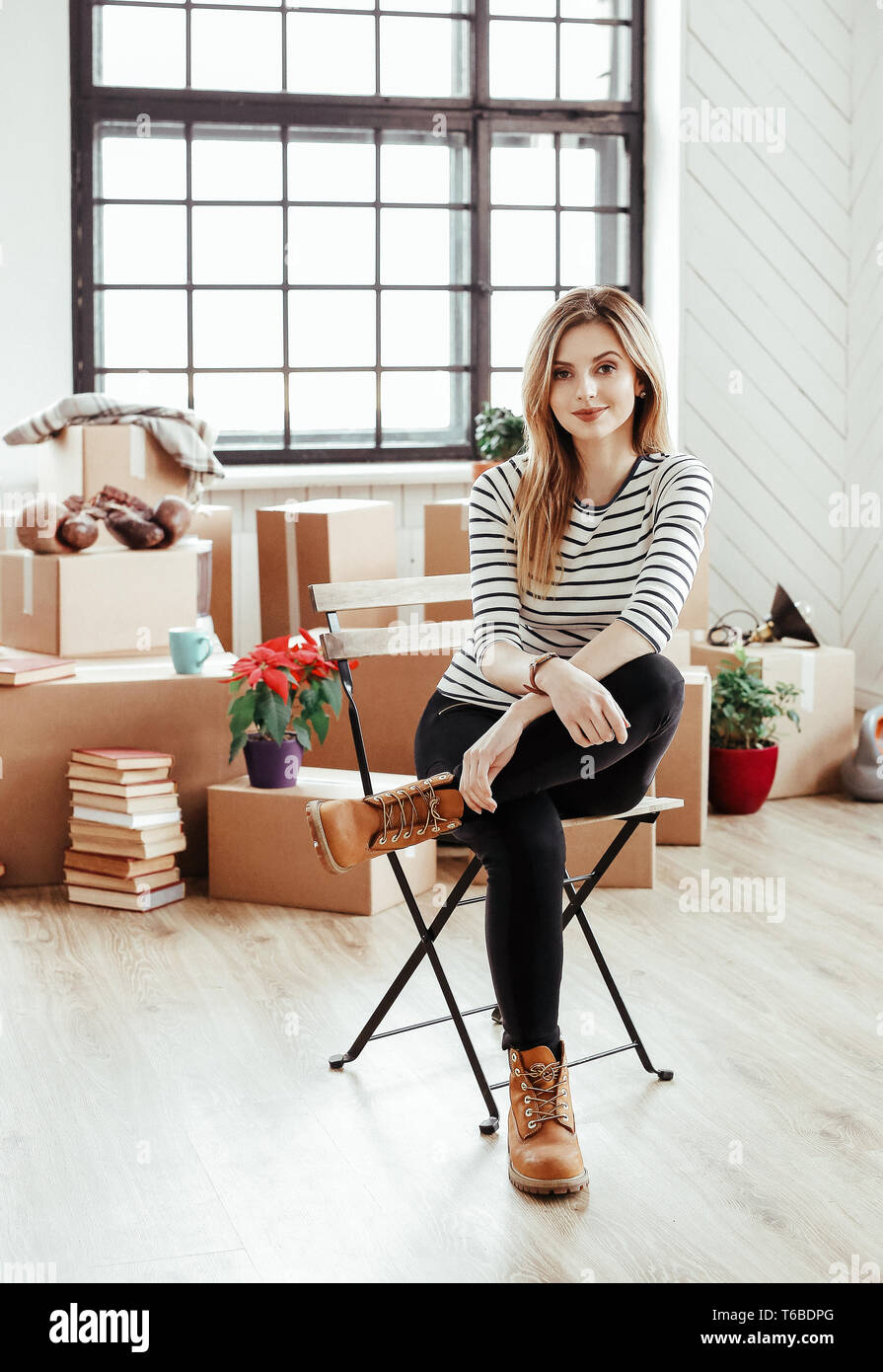 Girl is moving to new home Stock Photo - Alamy