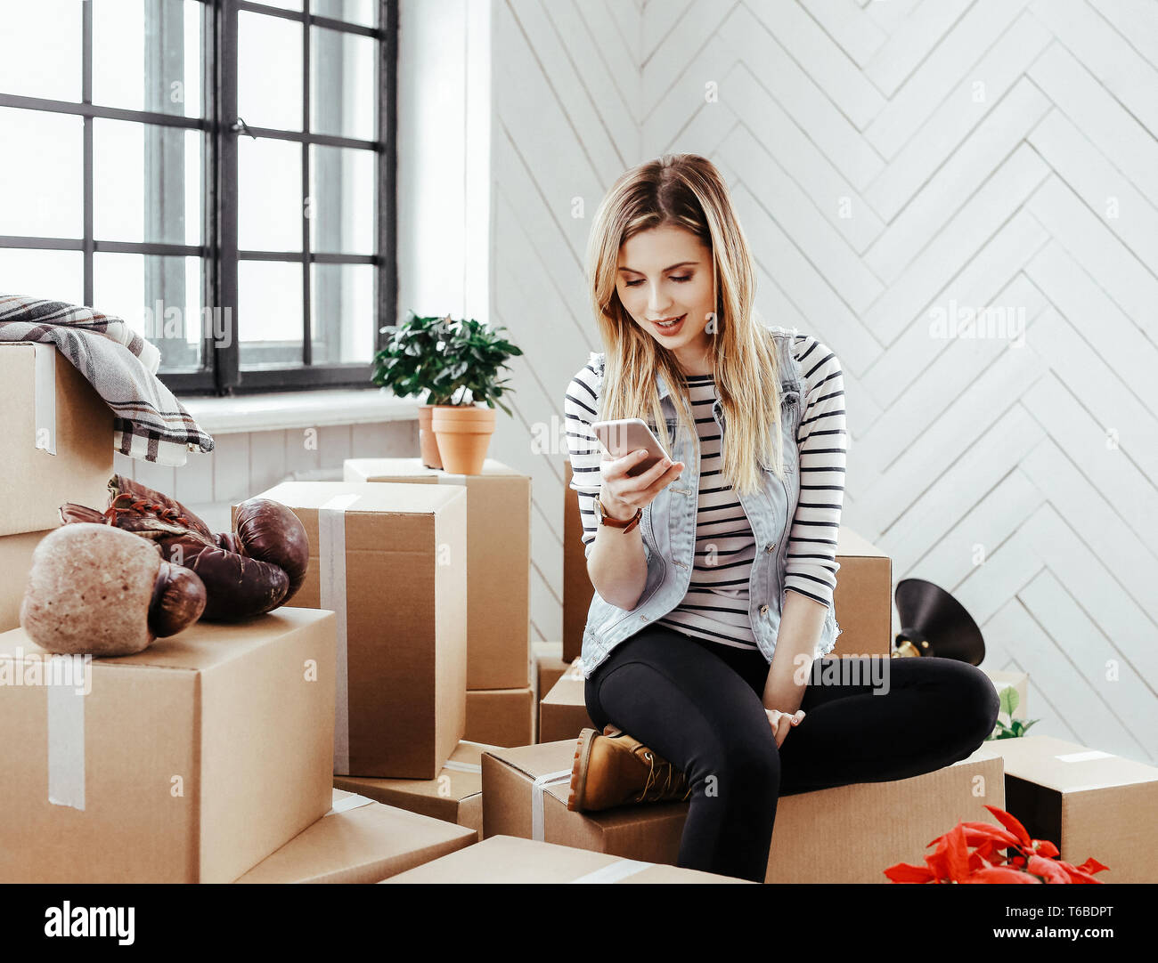 Girl is moving to new home Stock Photo - Alamy